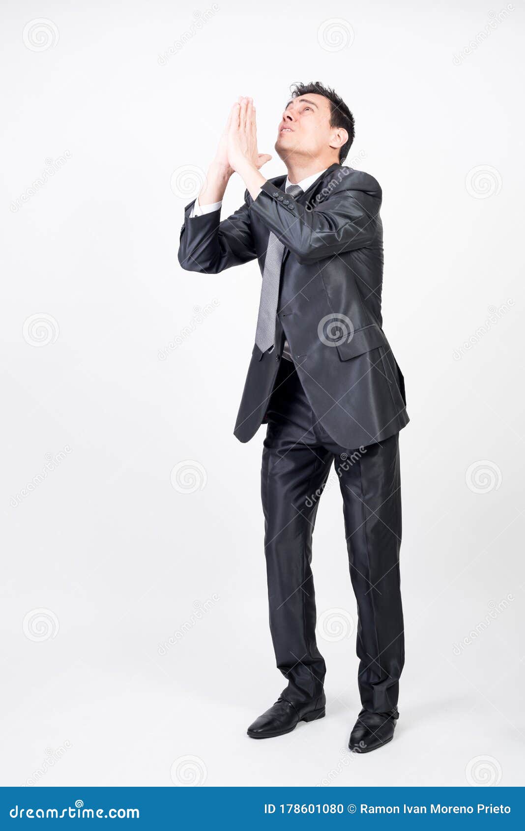 Man in suit praying stock photo. Image of full, prayer - 178601080
