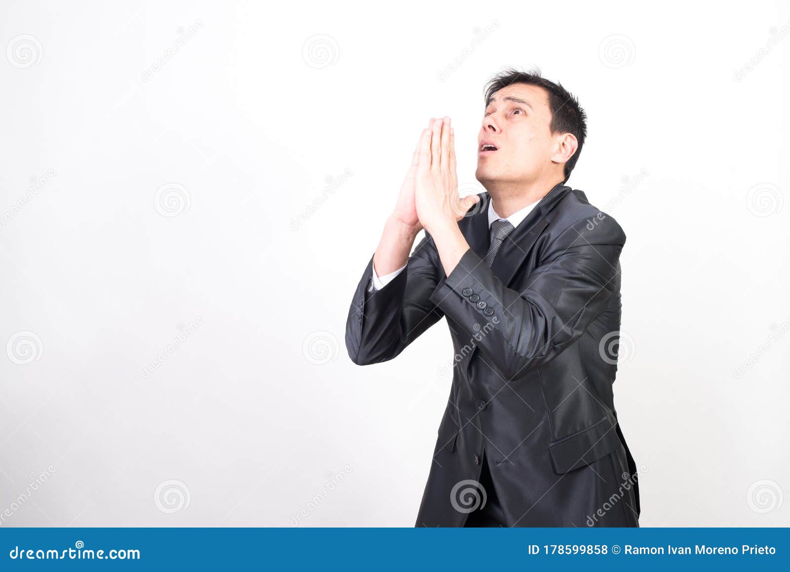 Man in suit praying stock photo. Image of male, christian - 178599858