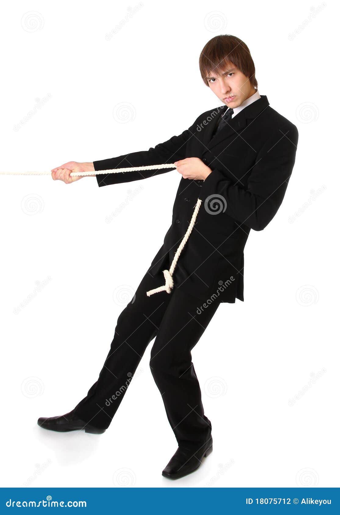 Man in suit pulling a rope stock photo. Image of person - 18075712