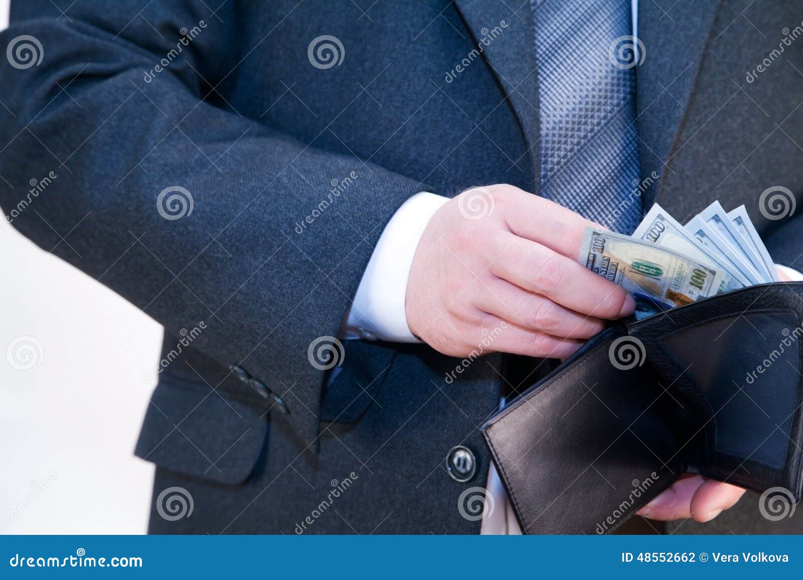 Man in Suit with a Purse in Hands Stock Photo - Image of paying, open ...