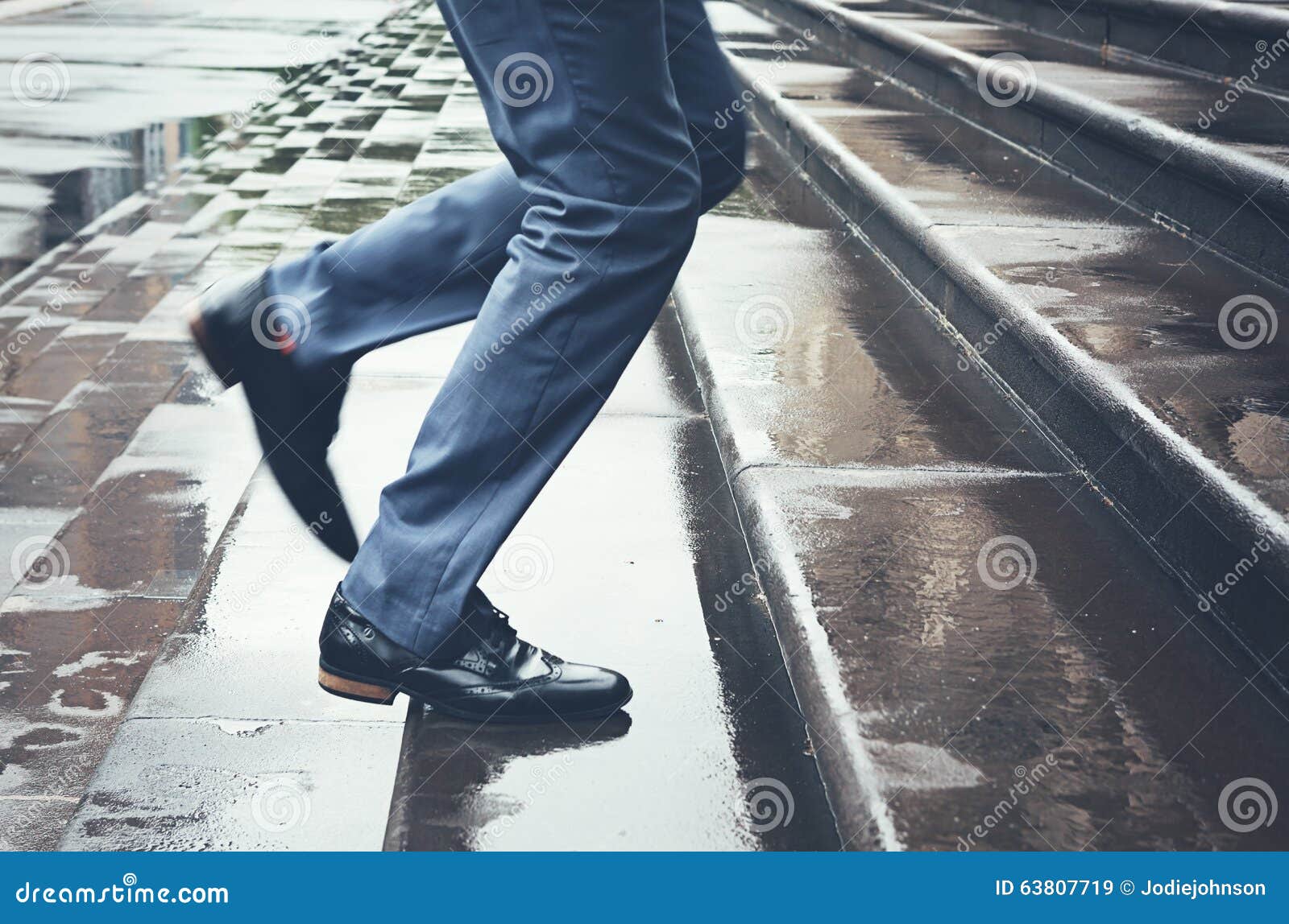 Man in Suit Running Late Up Steps in Rain Stock Image - Image of ...