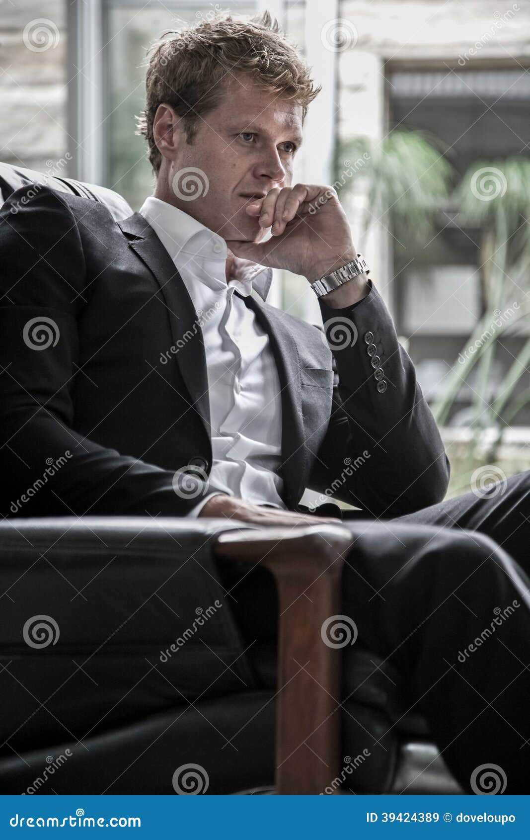 Young man in suit thinking stock image. Image of wear - 39424389