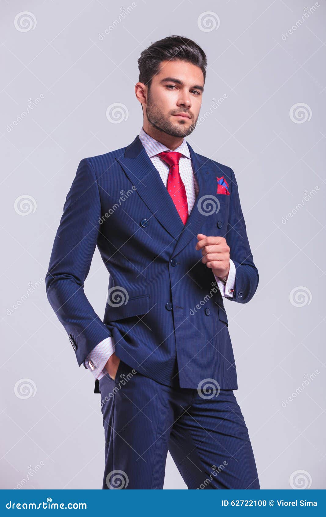 Man in Suit Standing in Studio Posing with Hand in Pocket Stock Photo ...