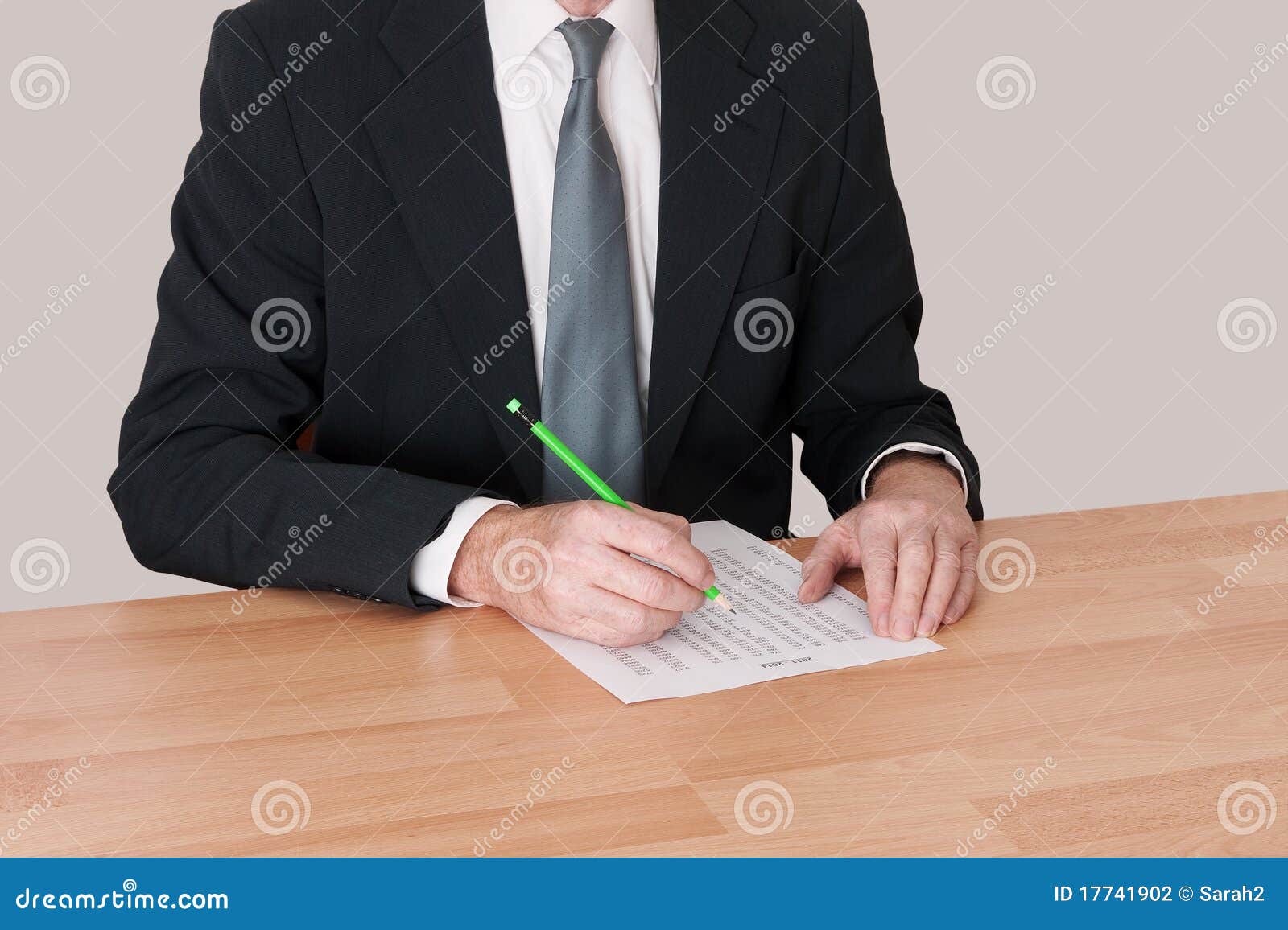 Man in Suit Studying Spreadsheet / Schedule Stock Photo - Image of ...