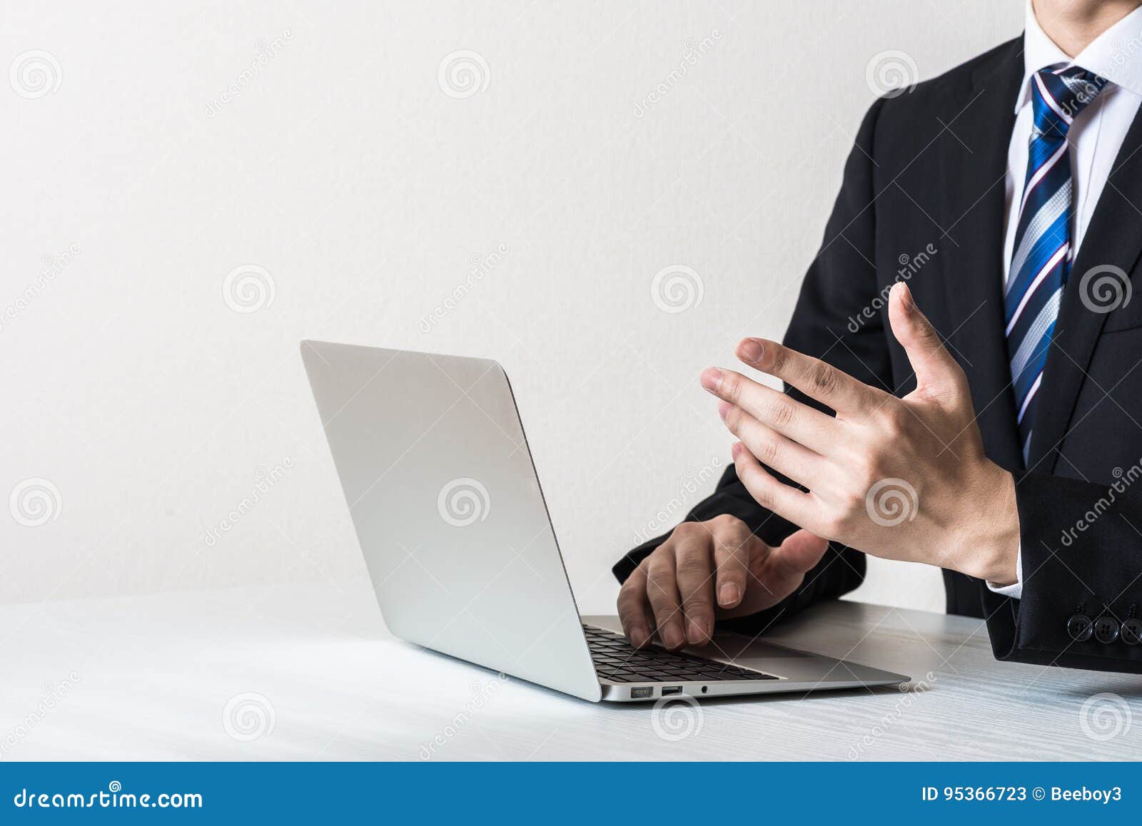 A Man in a Suit Watching a PC Stock Image - Image of male, talking ...