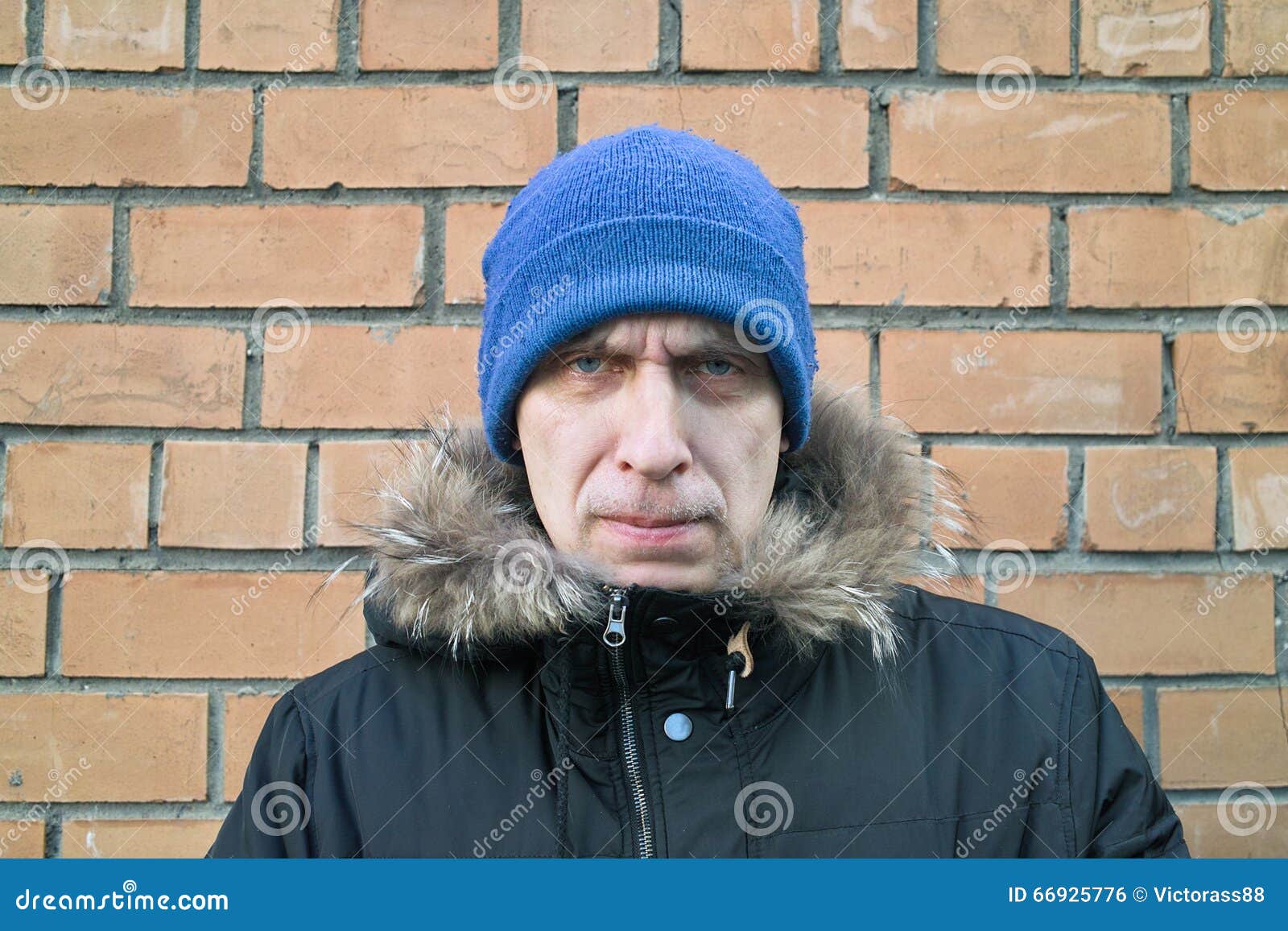 Man with Sullen Look stock photo. Image of jacket, front - 66925776