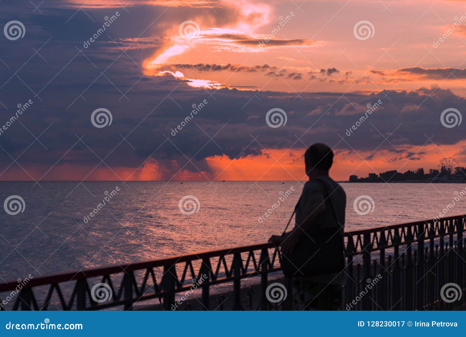 Man at sunset on the sea stock image. Image of holiday - 128230017