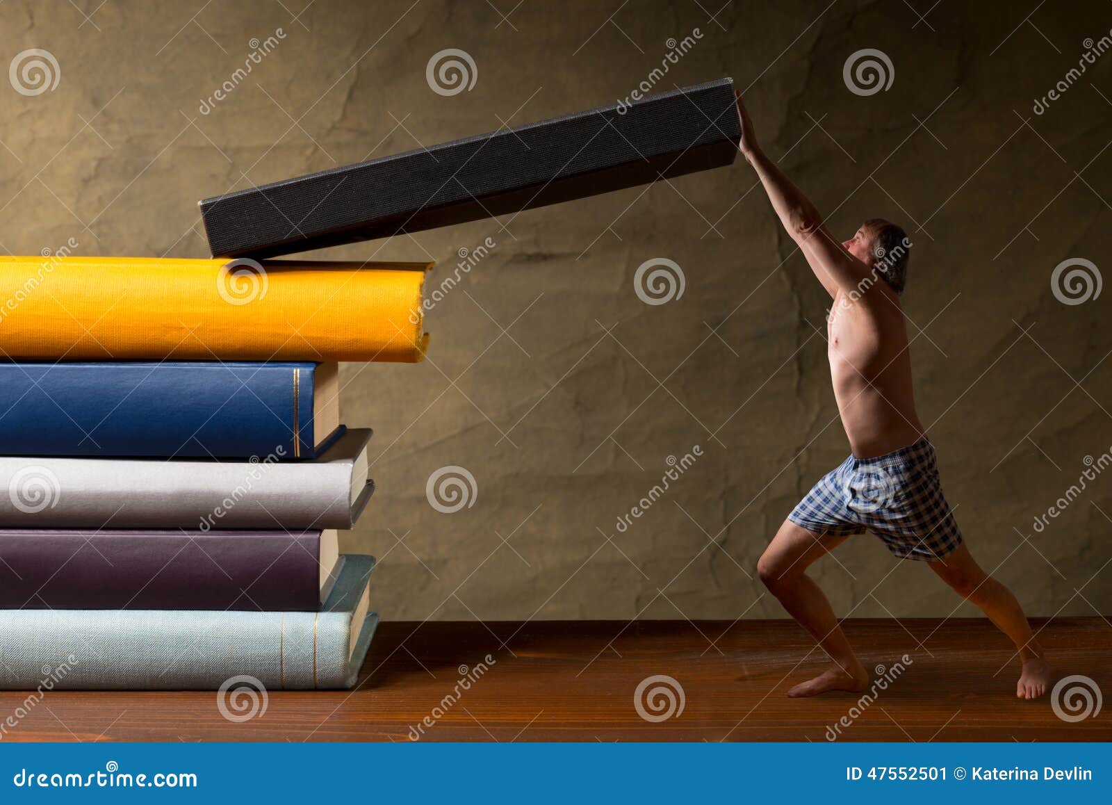 Man Supporting Falling Book in the Bookshelf Stock Image - Image of ...