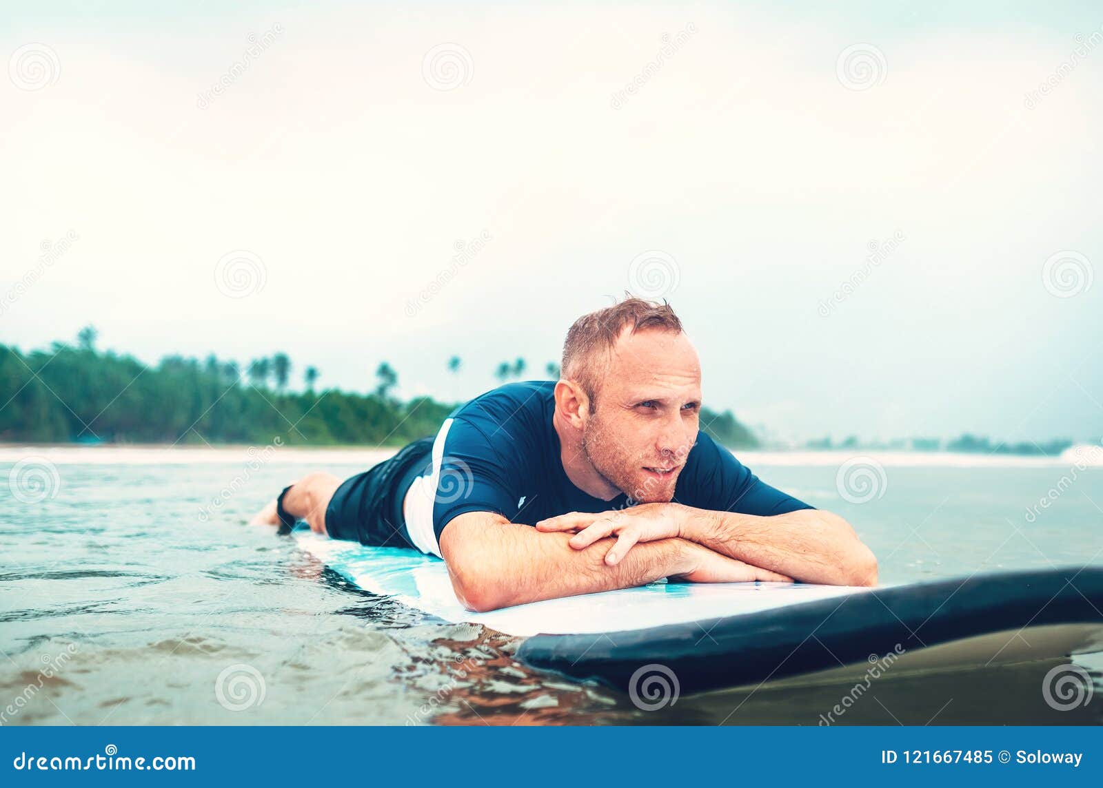 Man Surfer Rests Lying on Surfboard Stock Image - Image of action ...