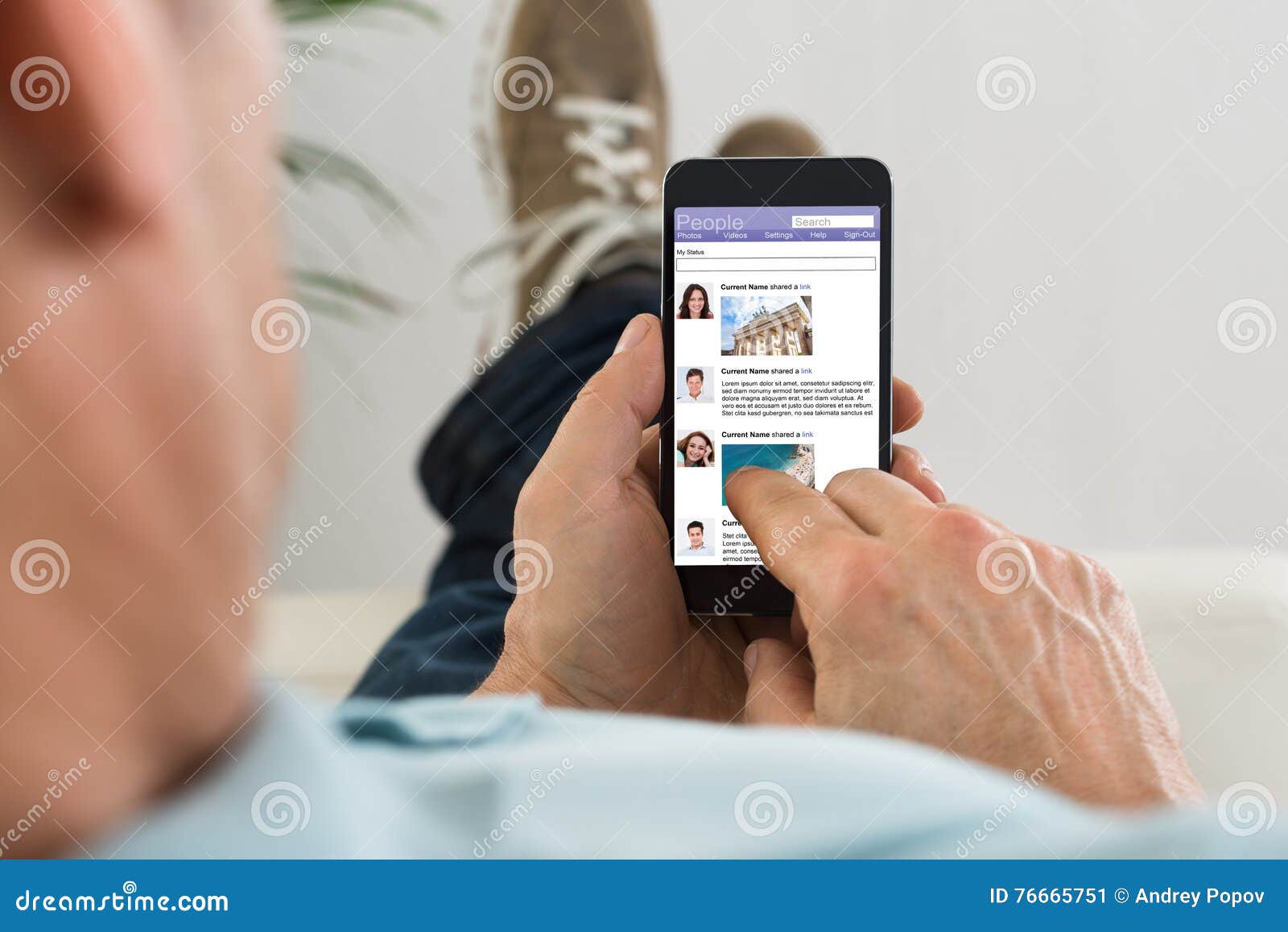 Man Surfing on Social Networking Site Using Cellphone Stock Image ...
