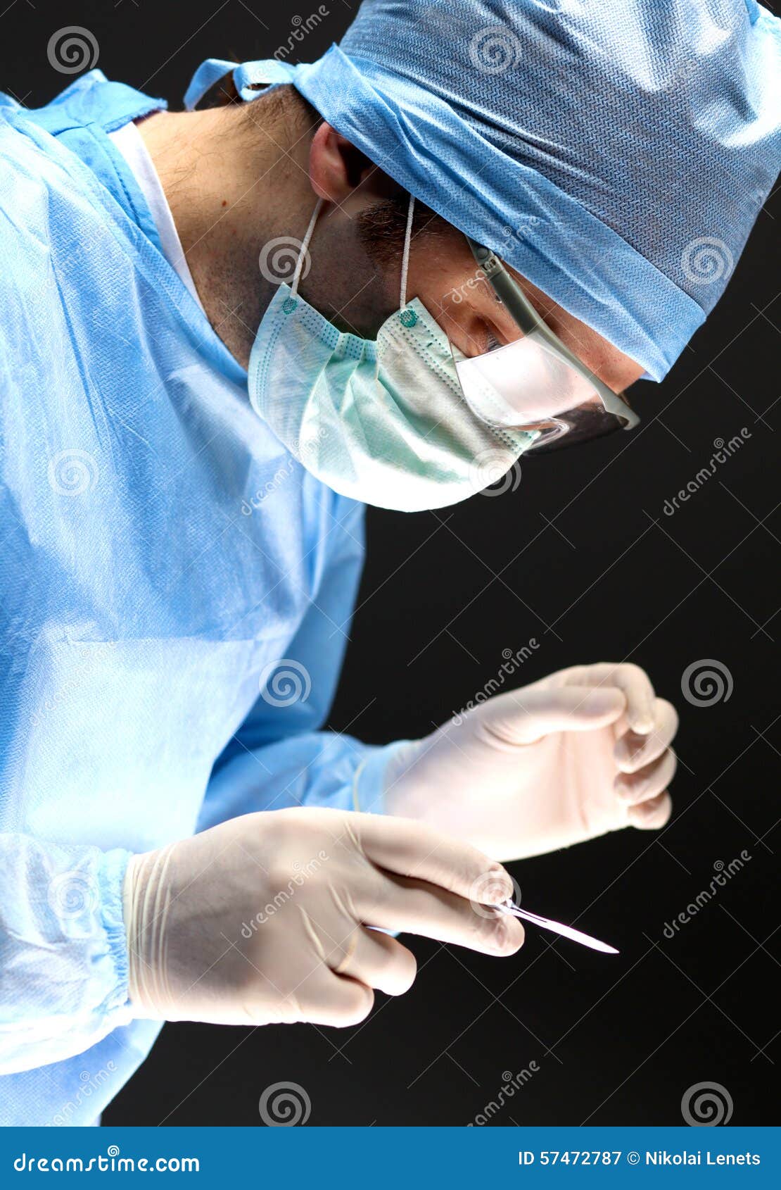 Man Surgeon Holds a Scalpel in an Operating Room Stock Image - Image of ...