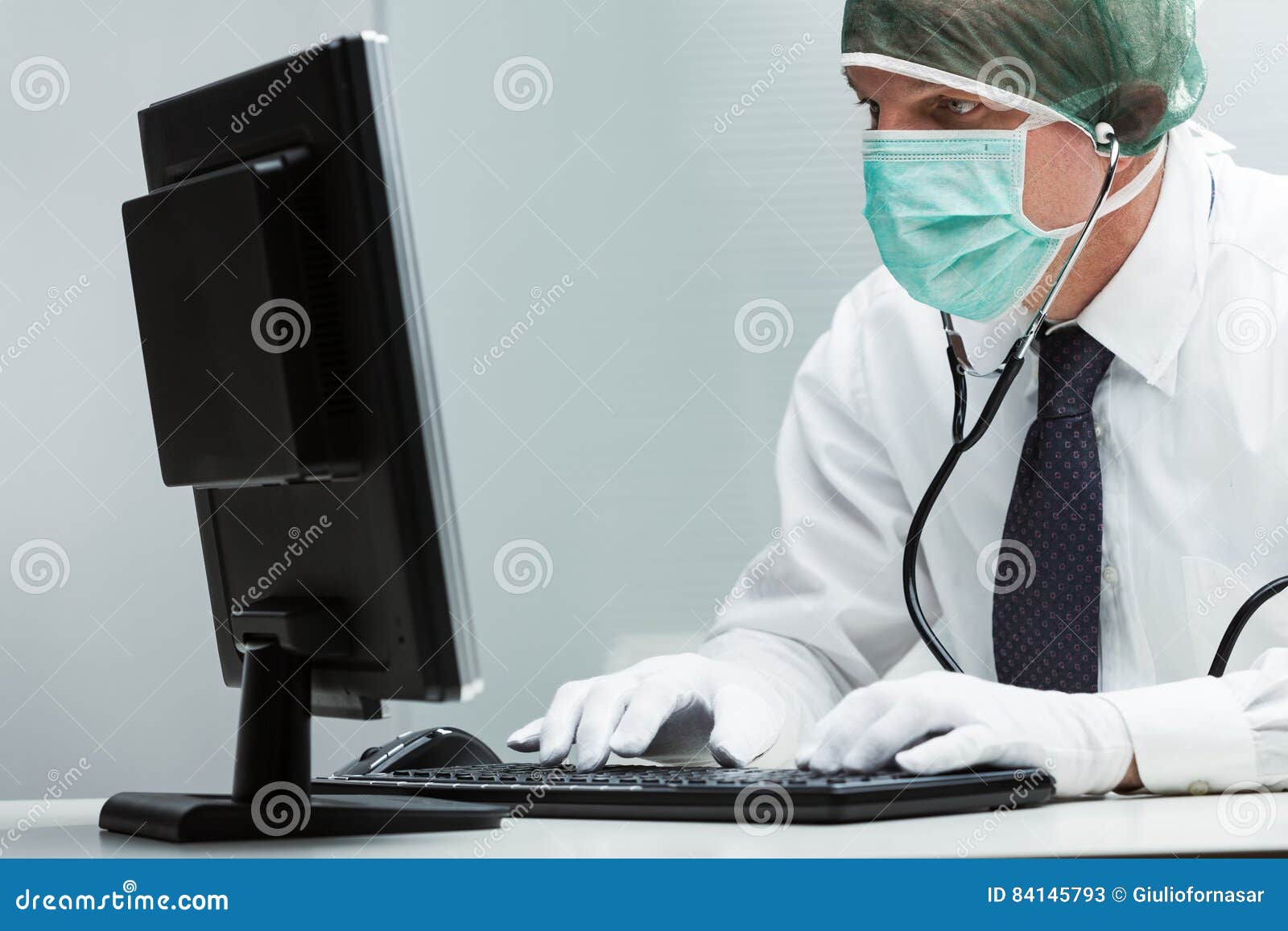 Man with a Surgical Mask Analizing a Computer Stock Image - Image of ...