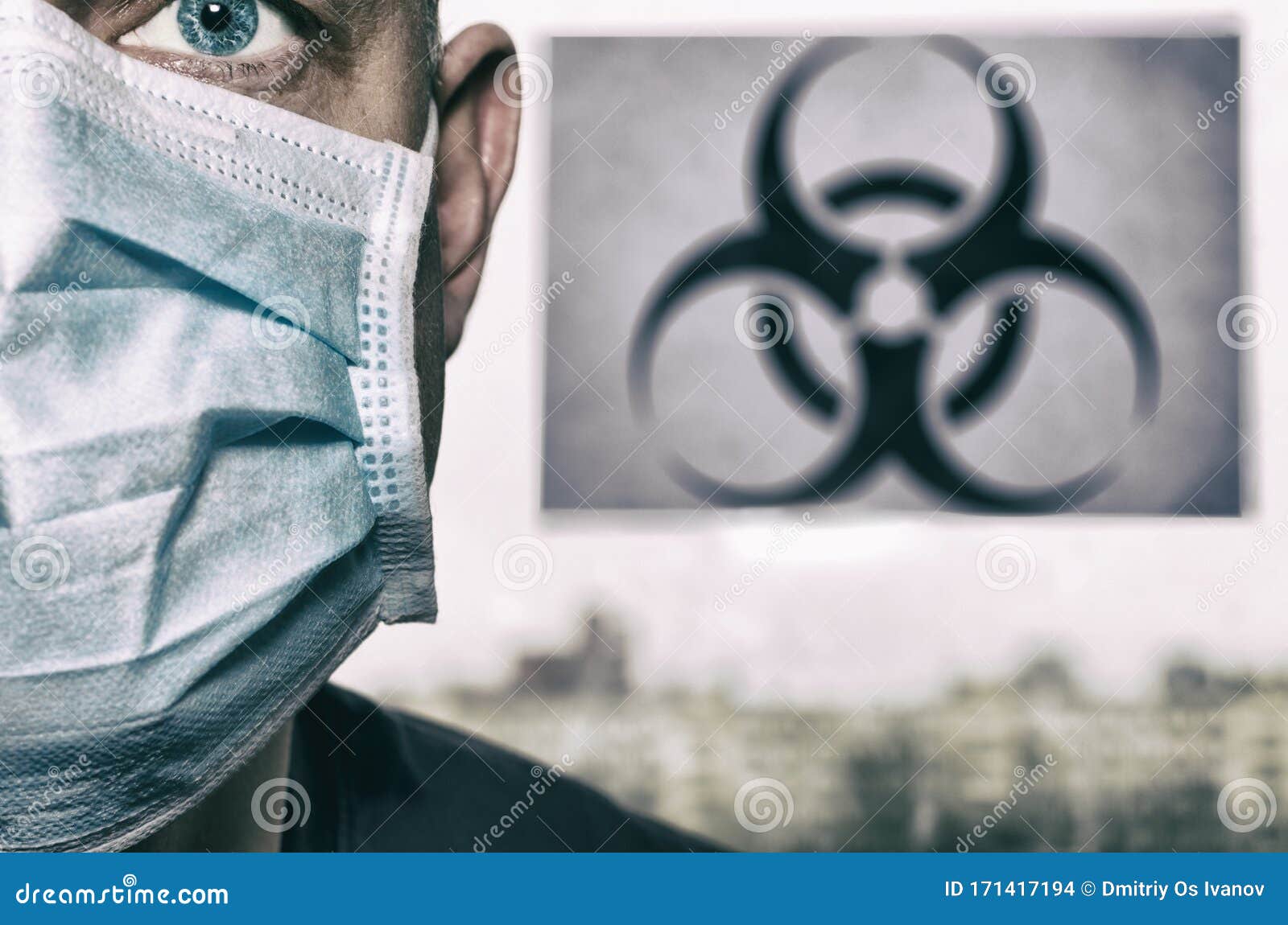 Man In A Surgical Mask In The Background `biohazard Sign` Stock Photo ...