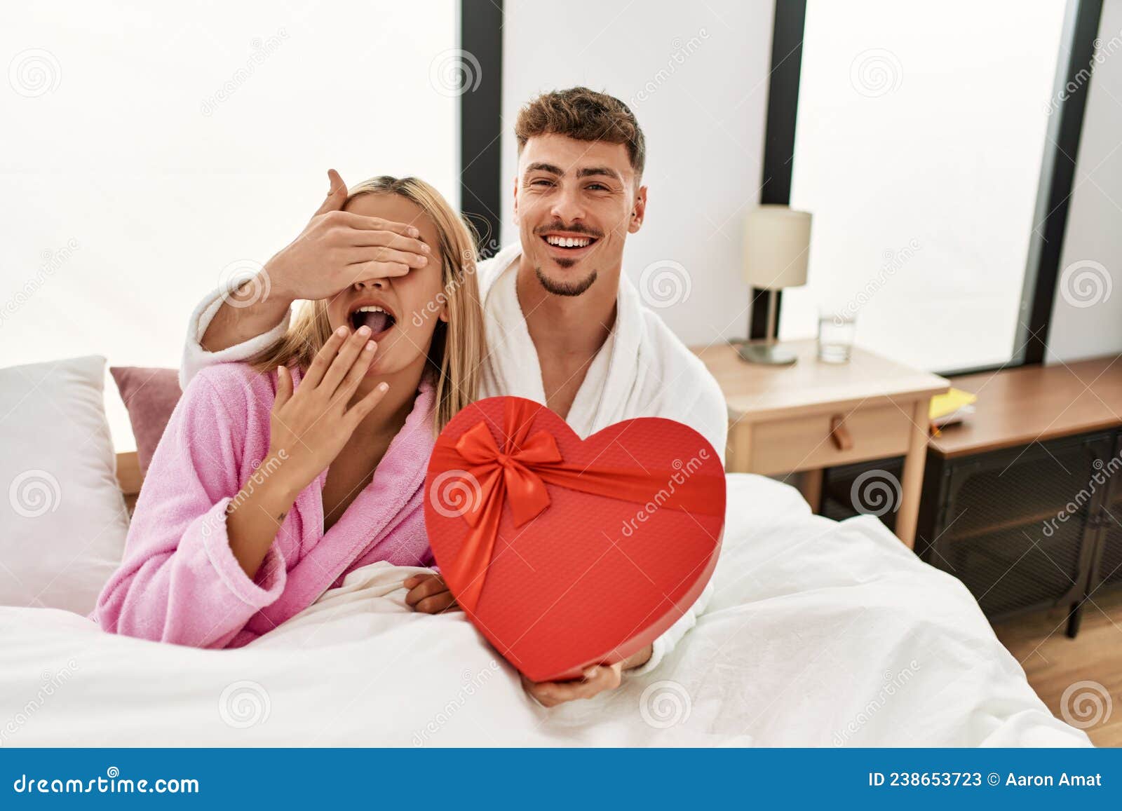 Man Surprising His Girlfriend With Valentine T Box Sitting On The