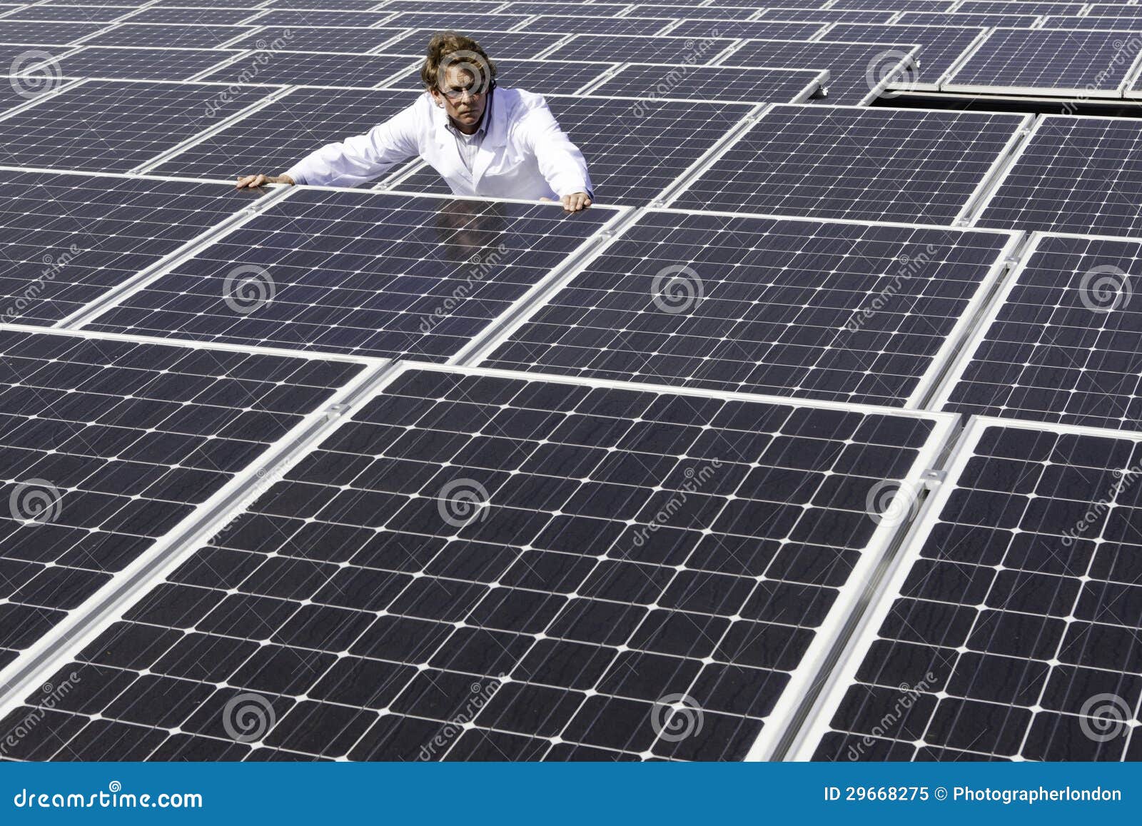 Man surveying solar panels stock image. Image of occupations - 29668275