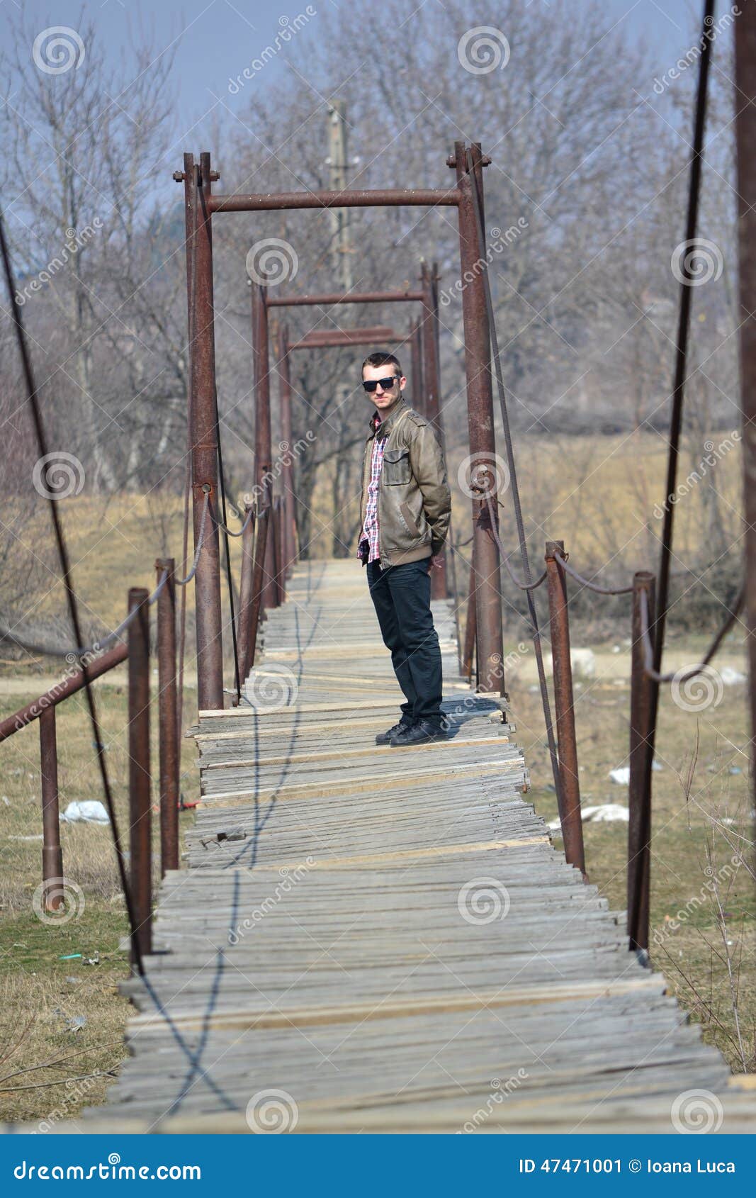 Man on a suspension bridge stock image. Image of trek - 47471001