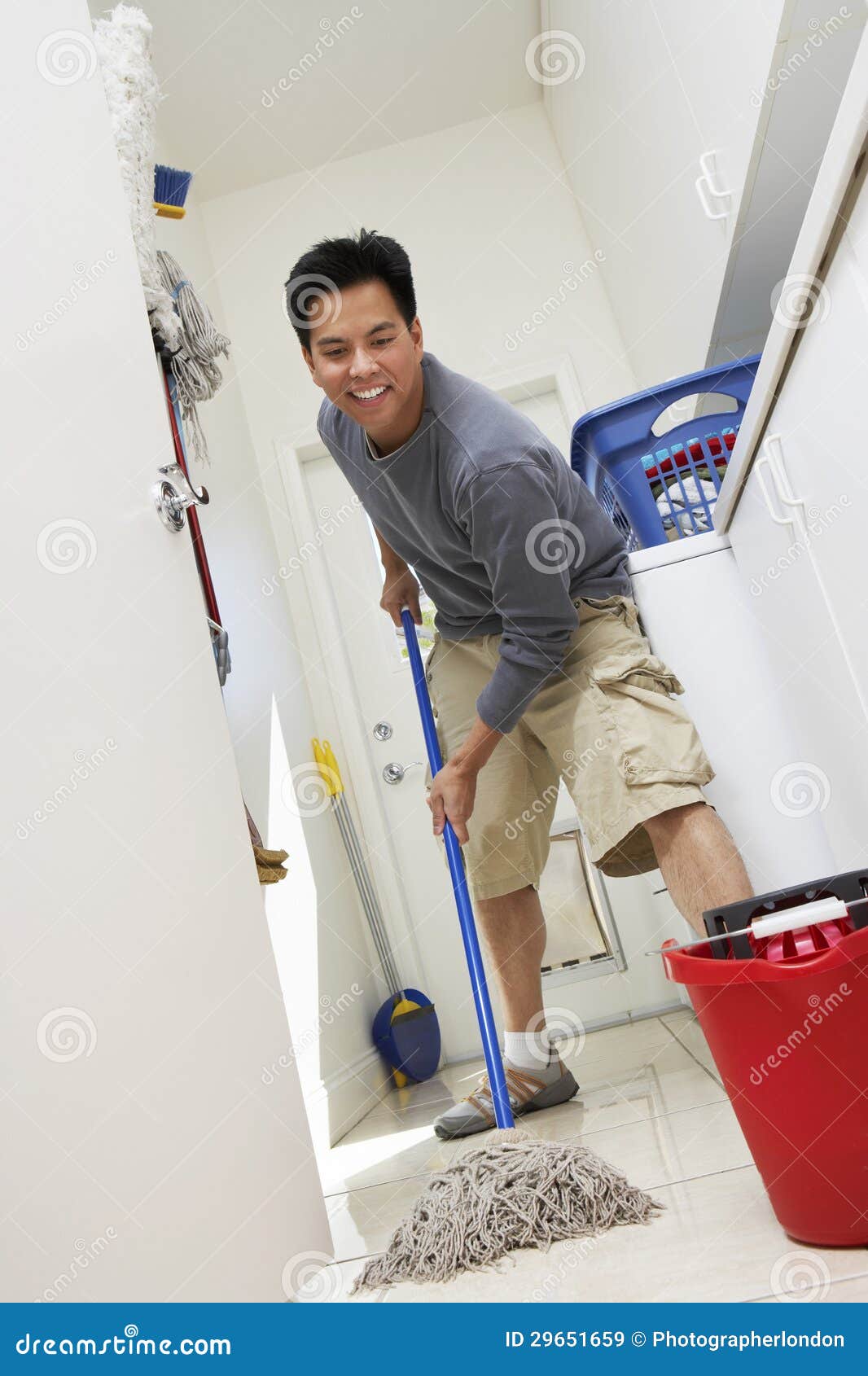 Man Sweeping The Floor