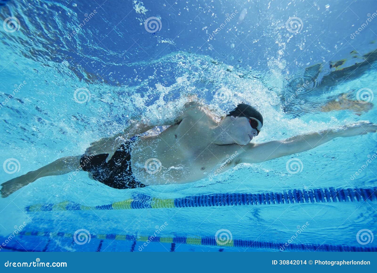 Man Swimming Underwater stock photo. Image of effort - 30842014