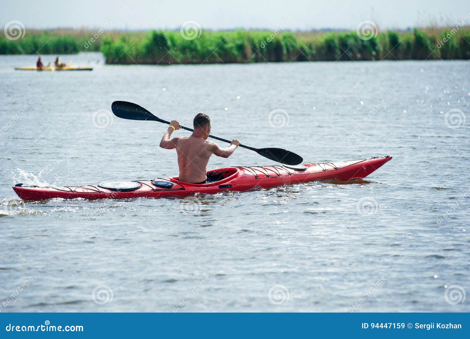 Man Swims on a Red Kayak 01 Stock Image - Image of leisure, outdoors ...