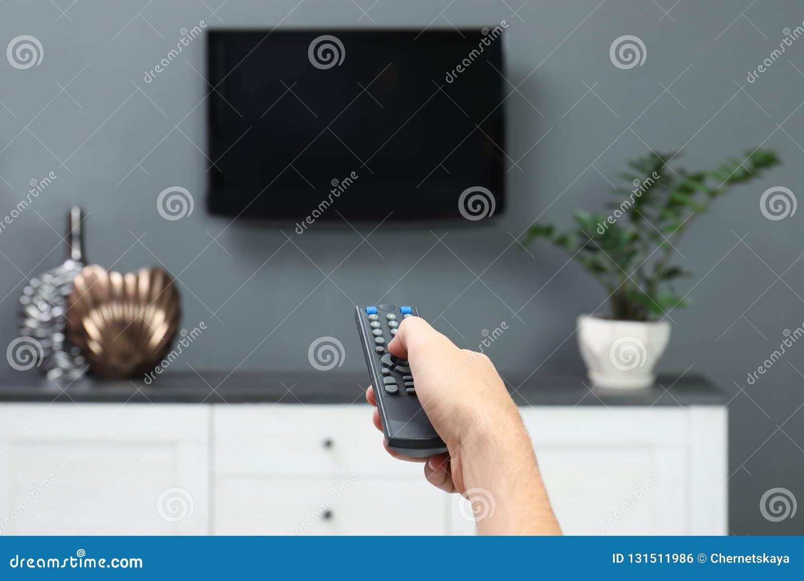 Man Switching Channels on Plasma TV with Remote Control Stock Photo ...