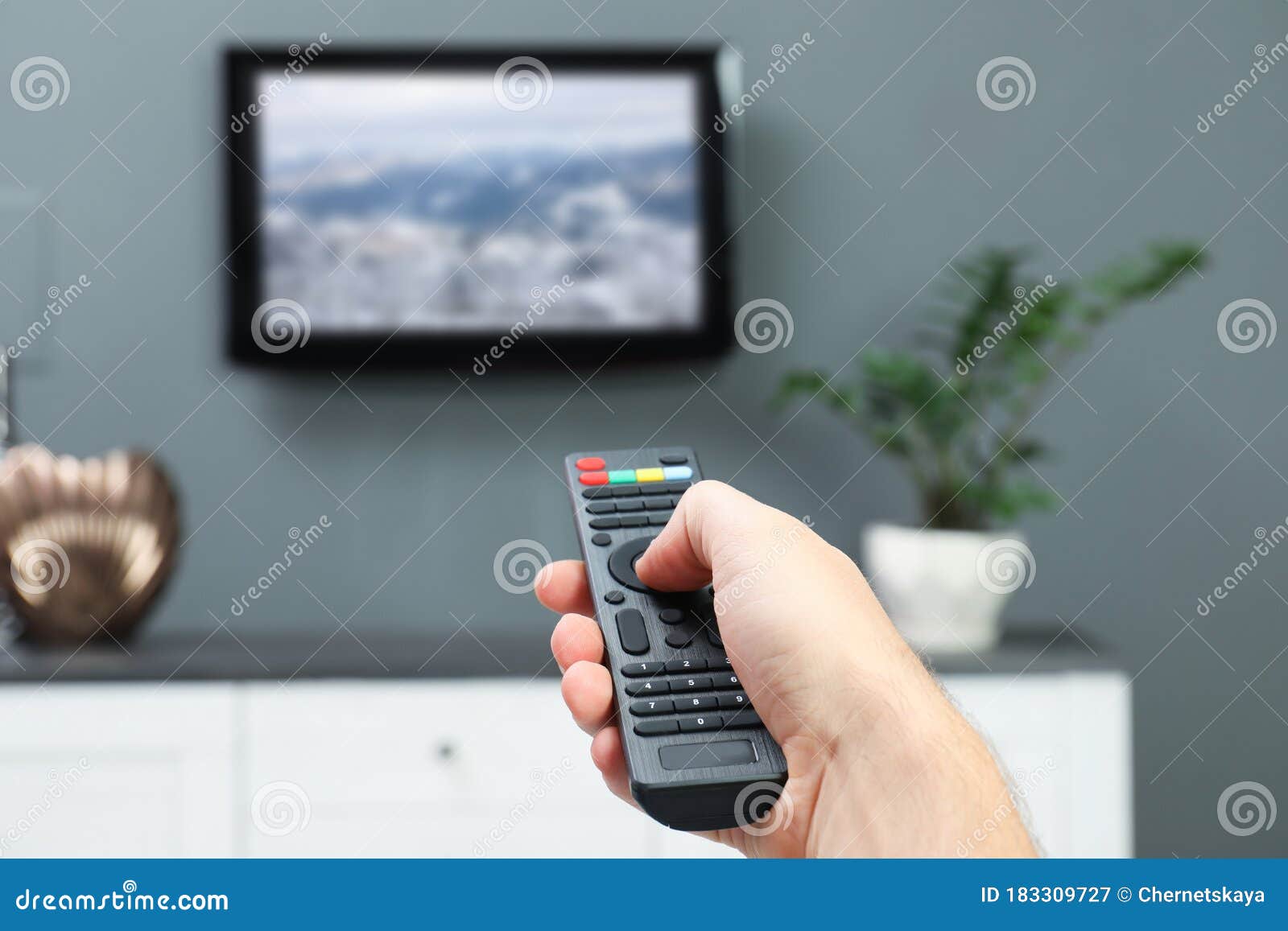 Man Switching Channels on TV with Remote Control Stock Image - Image of ... Man Switching Channels on TV with Remote Control Stock Image - Image of ...