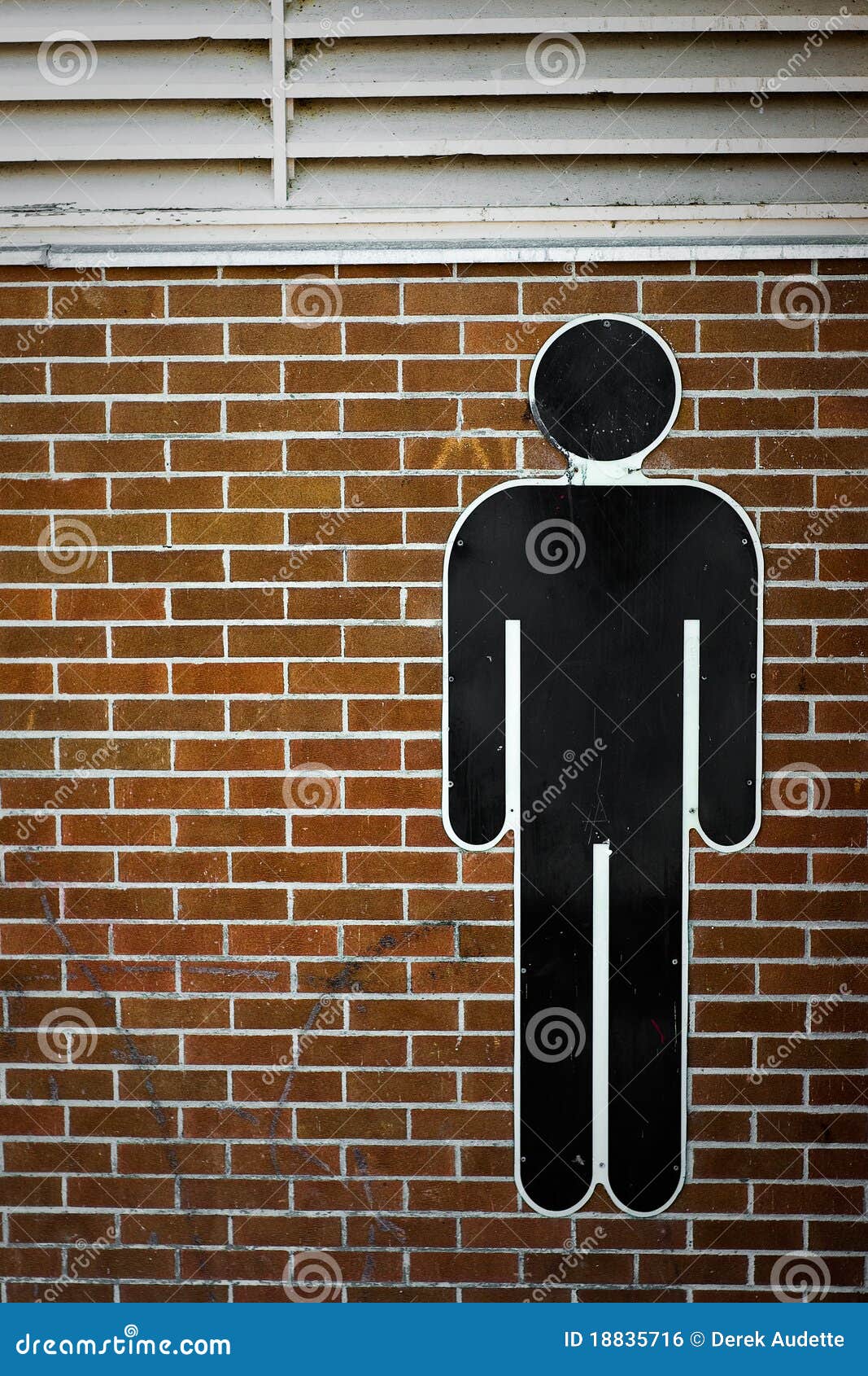 Man Symbol on Brick Wall stock photo. Image of shape - 18835716