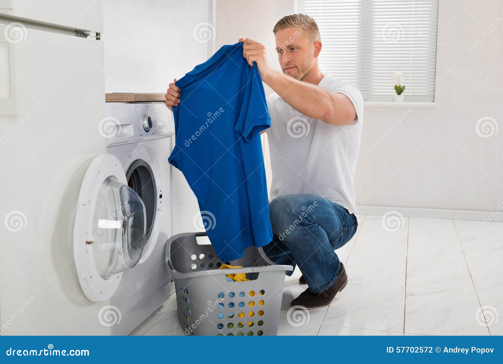 Man with T-shirt while Using Washing Machine Stock Photo - Image of ...
