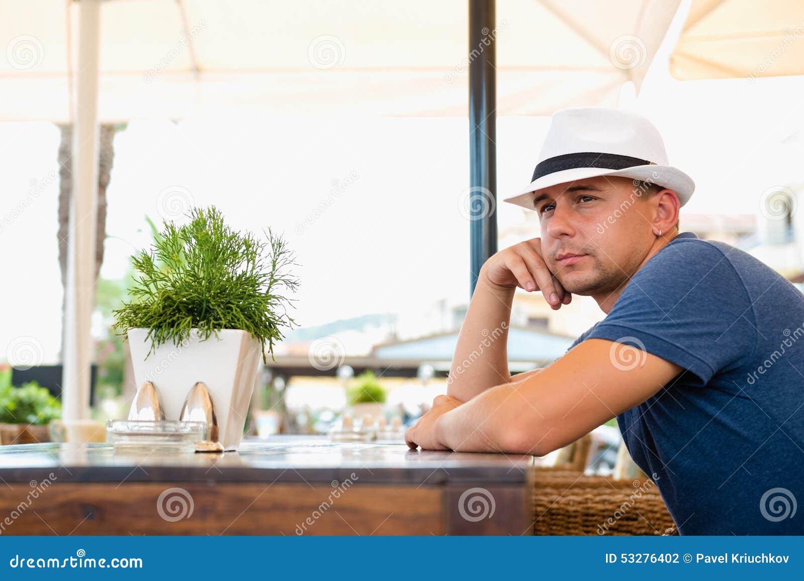 Man at a table in a cafe stock photo. Image of thinking - 53276402