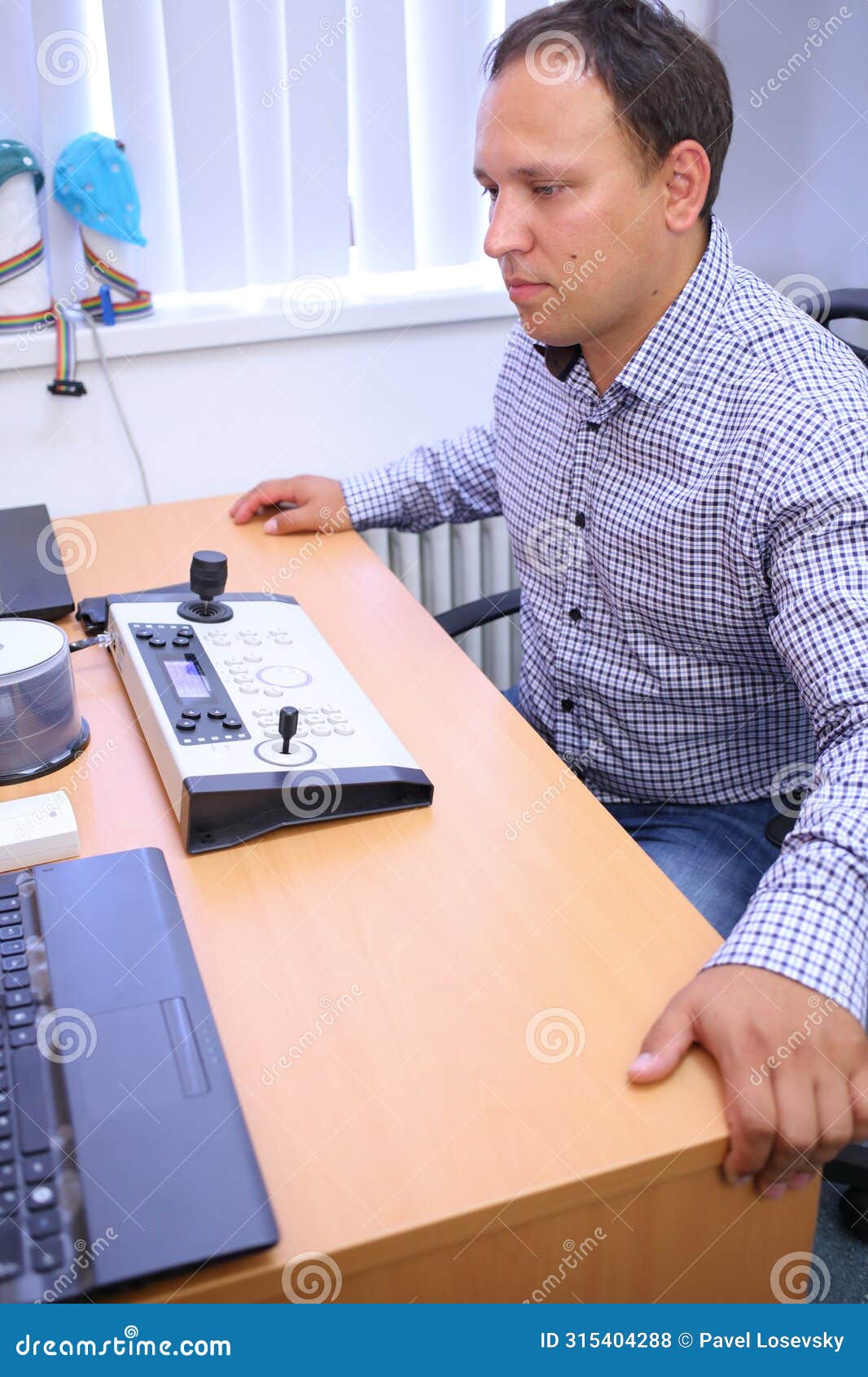 Man at the Table with the Control Panel in the Stock Photo - Image of ...