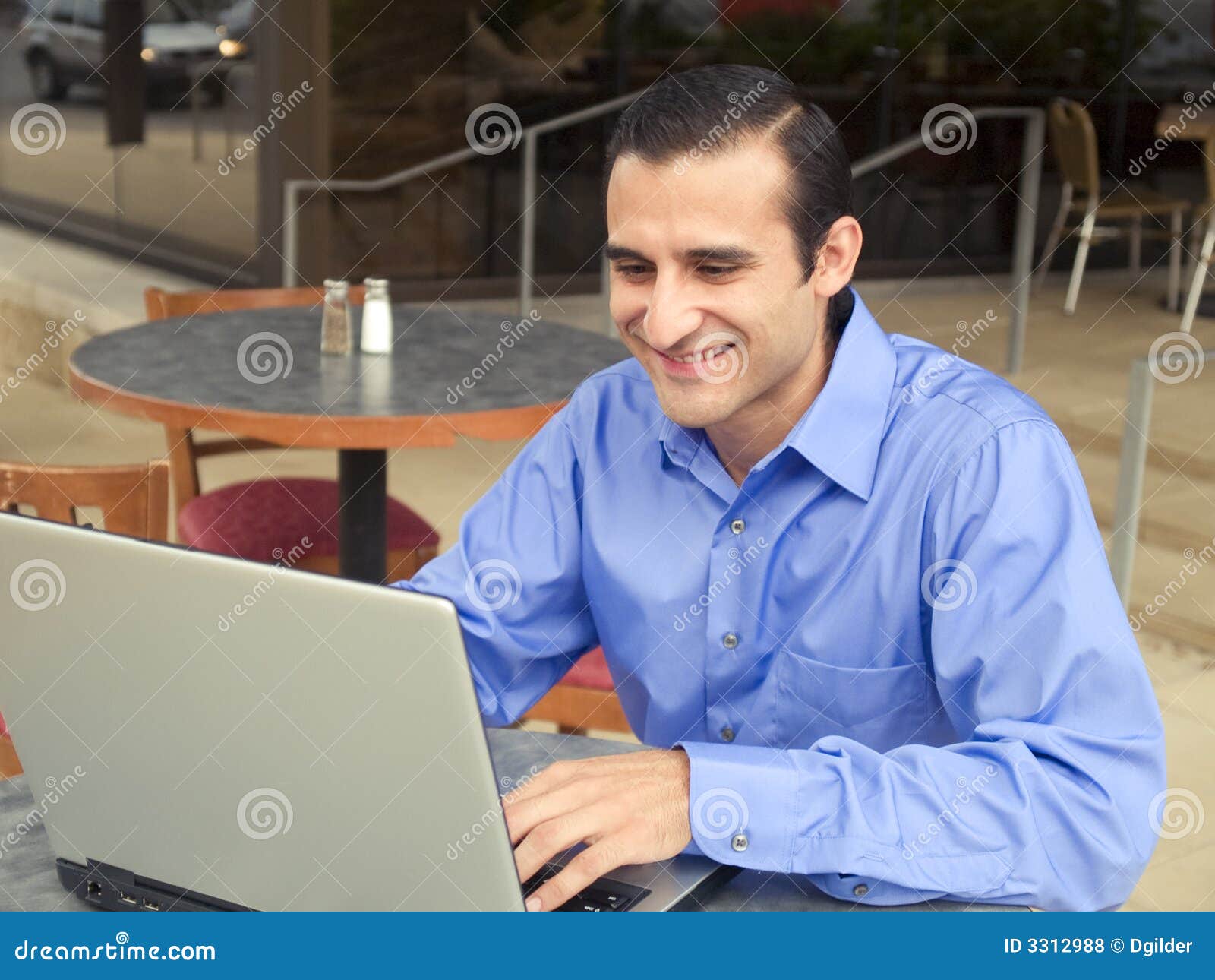 Man at table with laptop stock photo. Image of laptop - 3312988