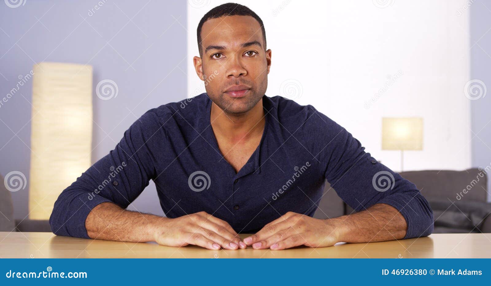 Man at Table Looking To Camera Stock Photo - Image of alone, greeting ...
