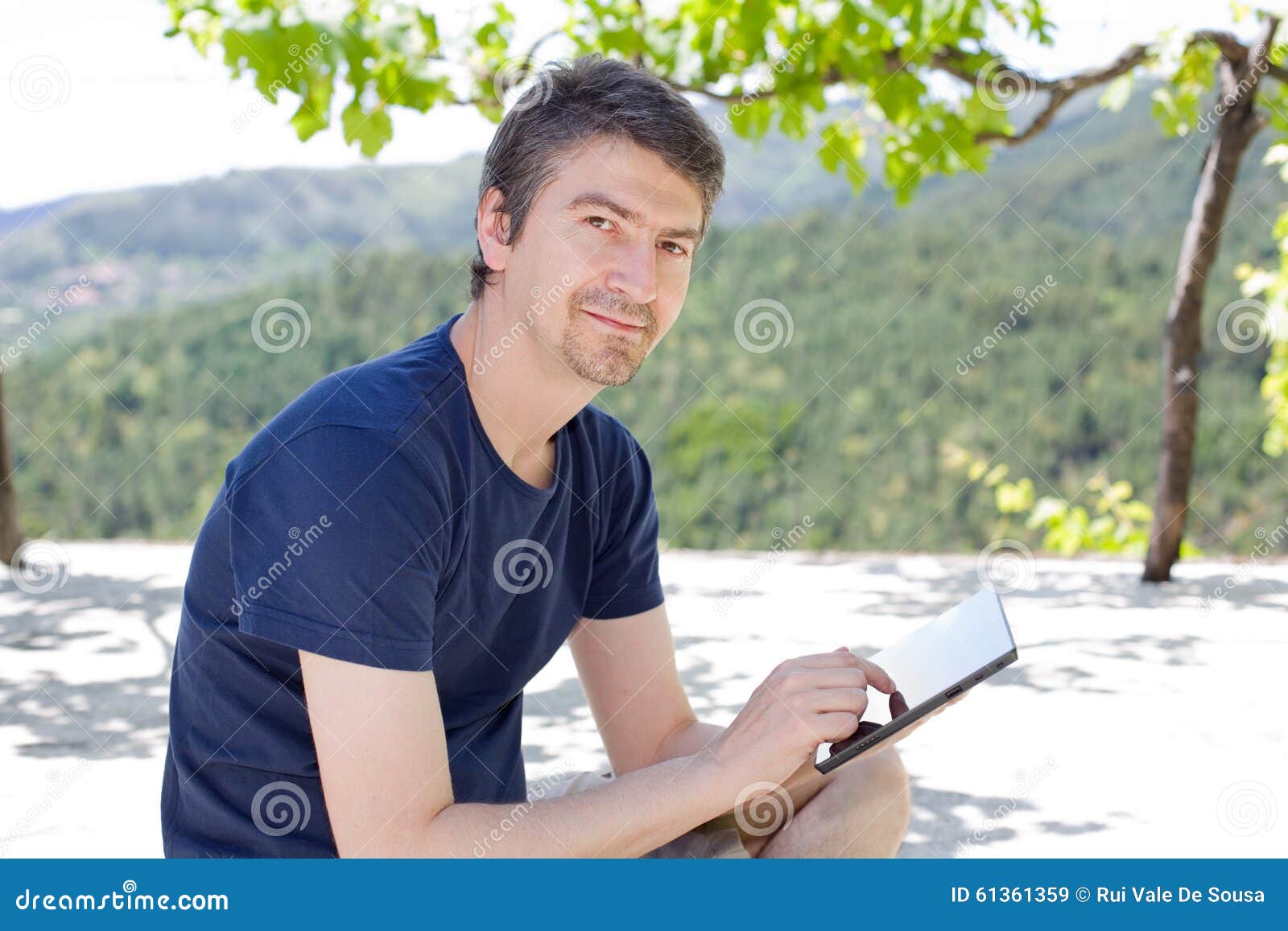 Man with tablet stock image. Image of garden, lifestyle - 61361359