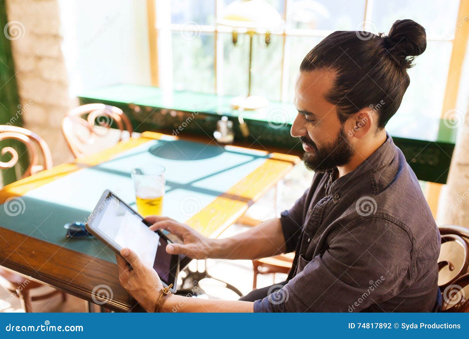 Man with Tablet Pc Drinking Beer at Bar or Pub Stock Photo - Image of ...