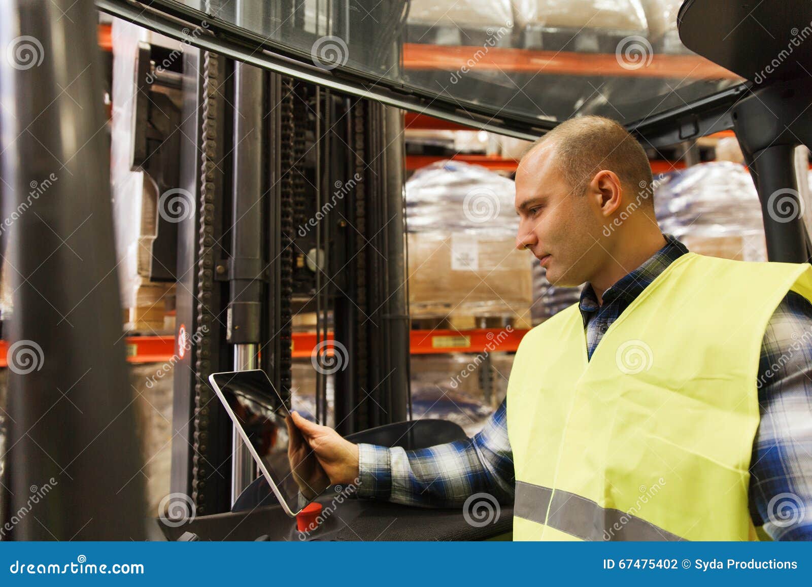 Man with Tablet Pc Operating Forklift at Warehouse Stock Photo - Image ...