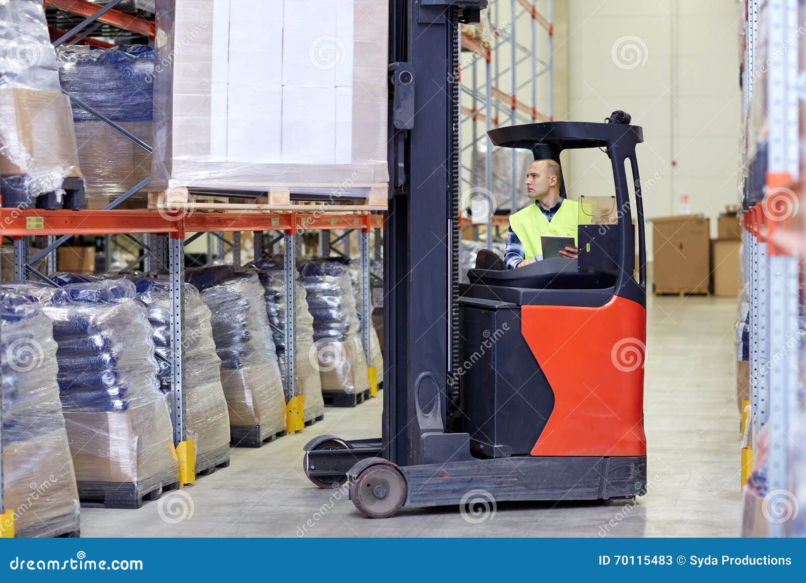 Man with Tablet Pc Operating Forklift at Warehouse Stock Image - Image ...