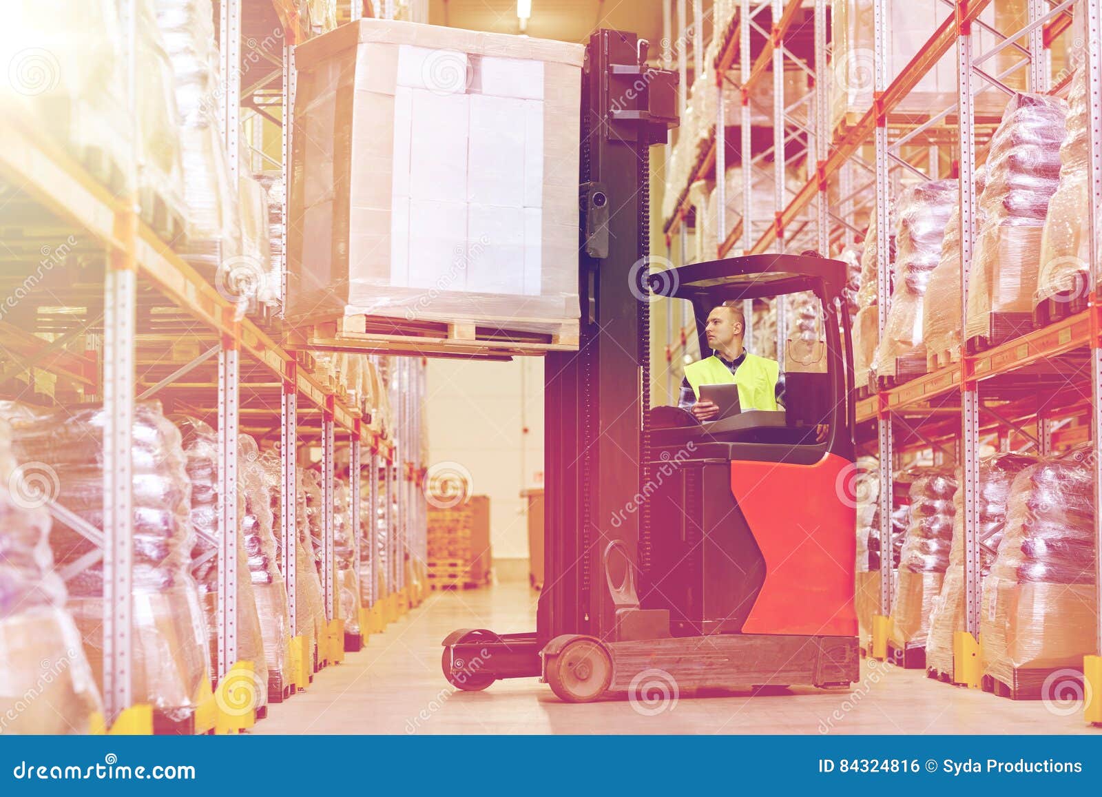 Man with Tablet Pc Operating Forklift at Warehouse Stock Photo - Image ...