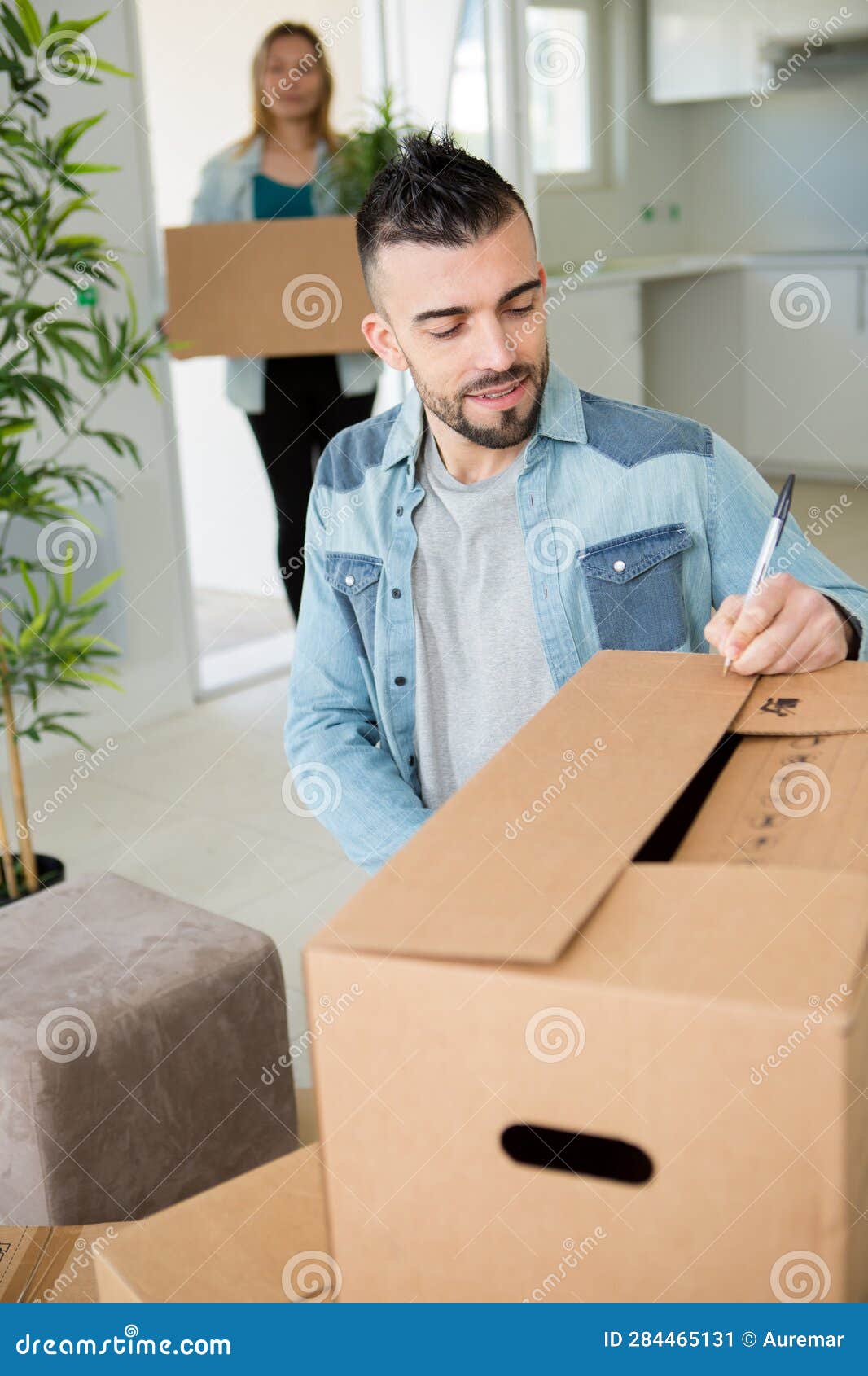Man tagging a box stock image. Image of adult, tagging - 284465131