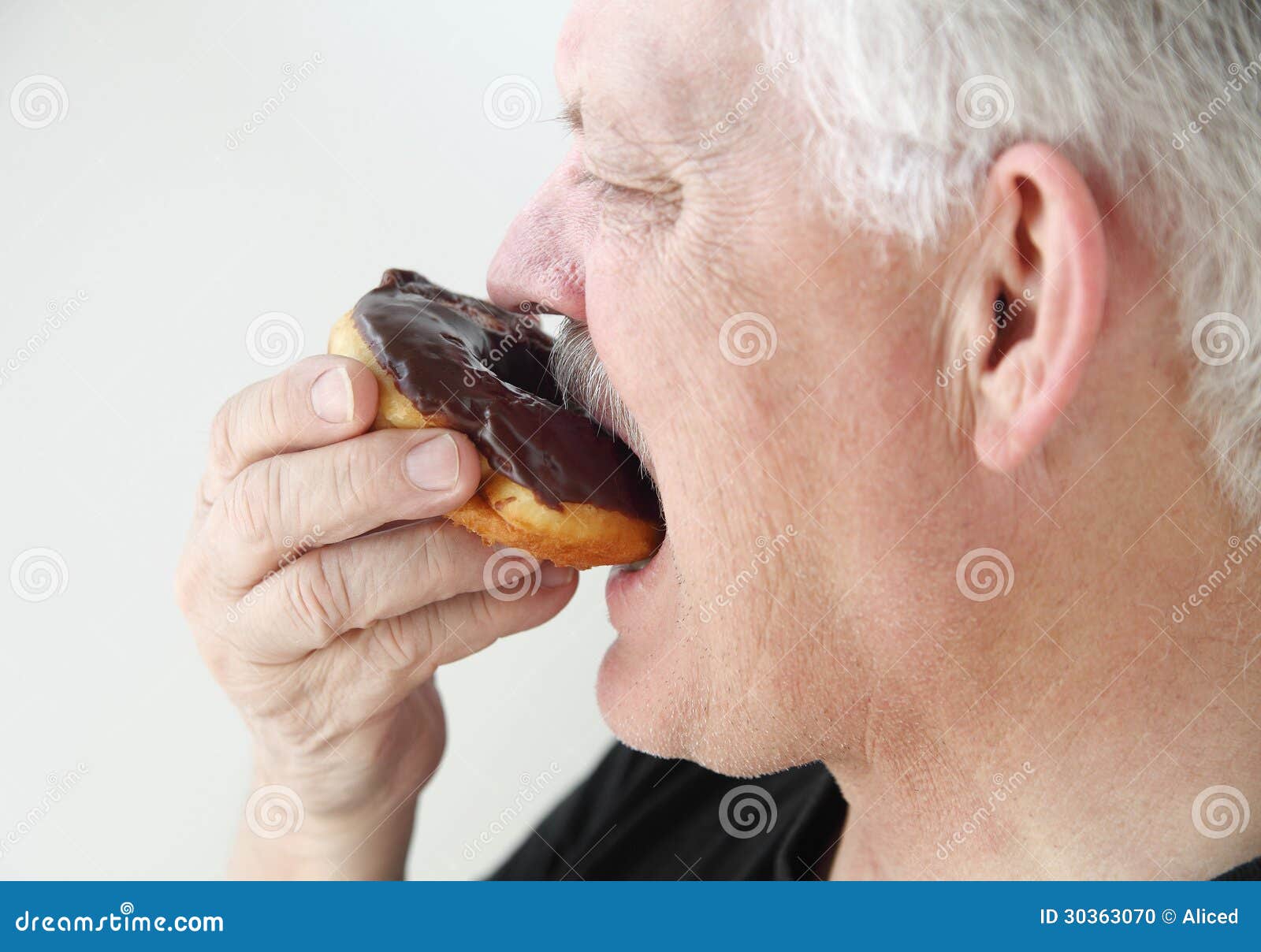Man takes bite of doughnut stock photo. Image of diet - 30363070