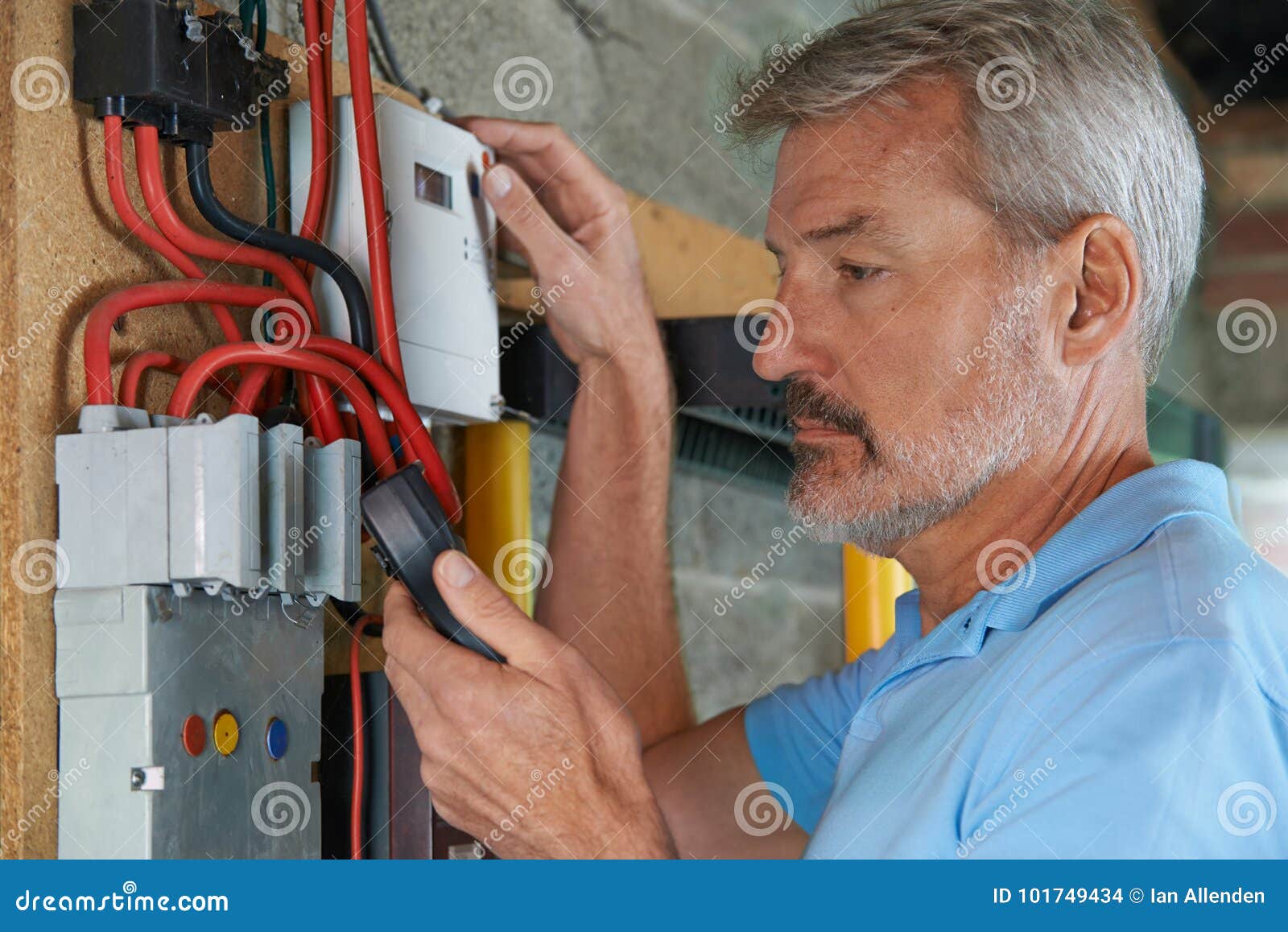 Man Taking Reading from Electricity Meter Stock Photo - Image of person ...