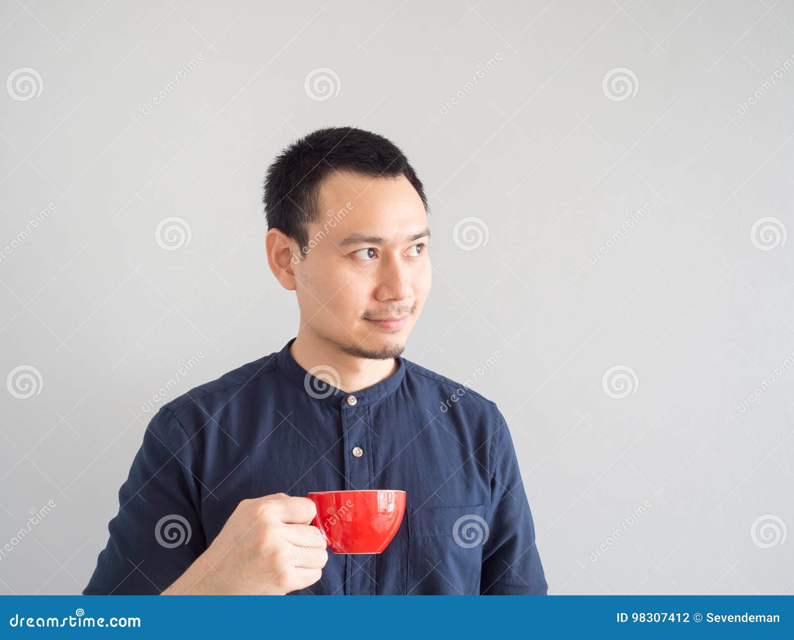 Man Takes a Sip of Coffee in Red Cup. Stock Photo - Image of holding ...