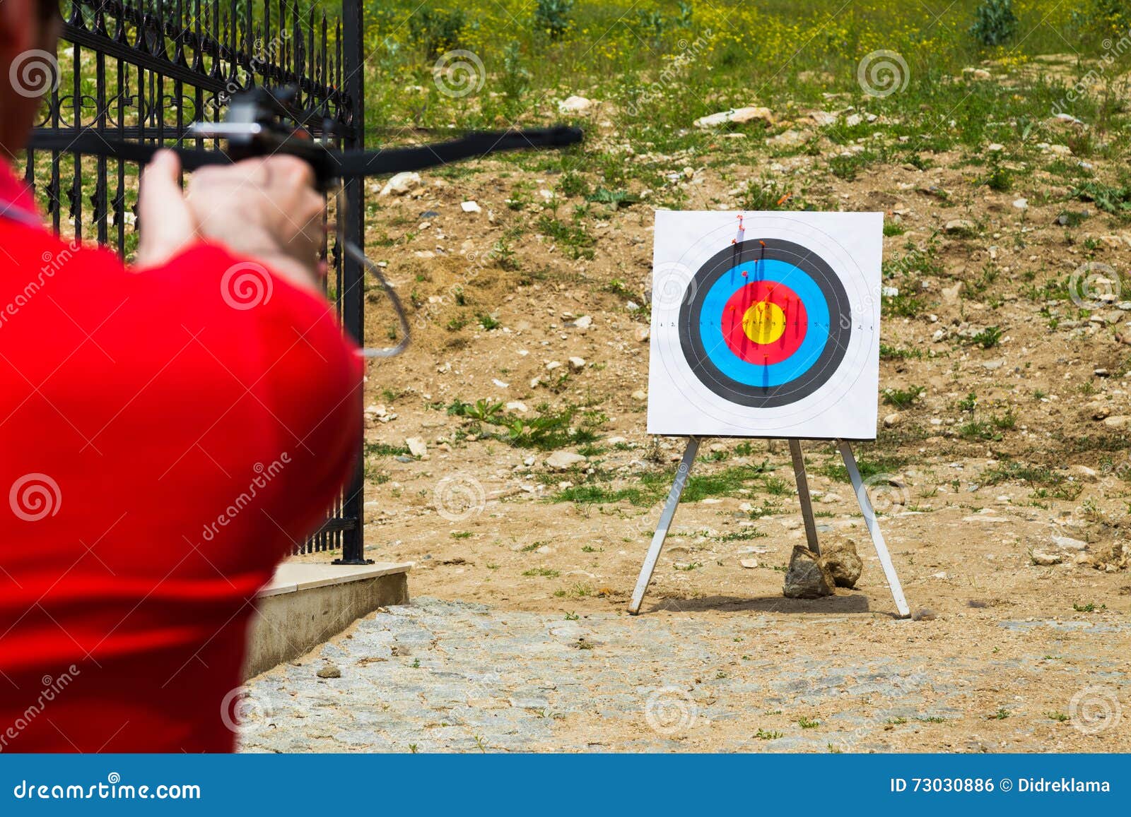 Man Taking Aim with a Crossbow at a Target Stock Photo - Image of ...