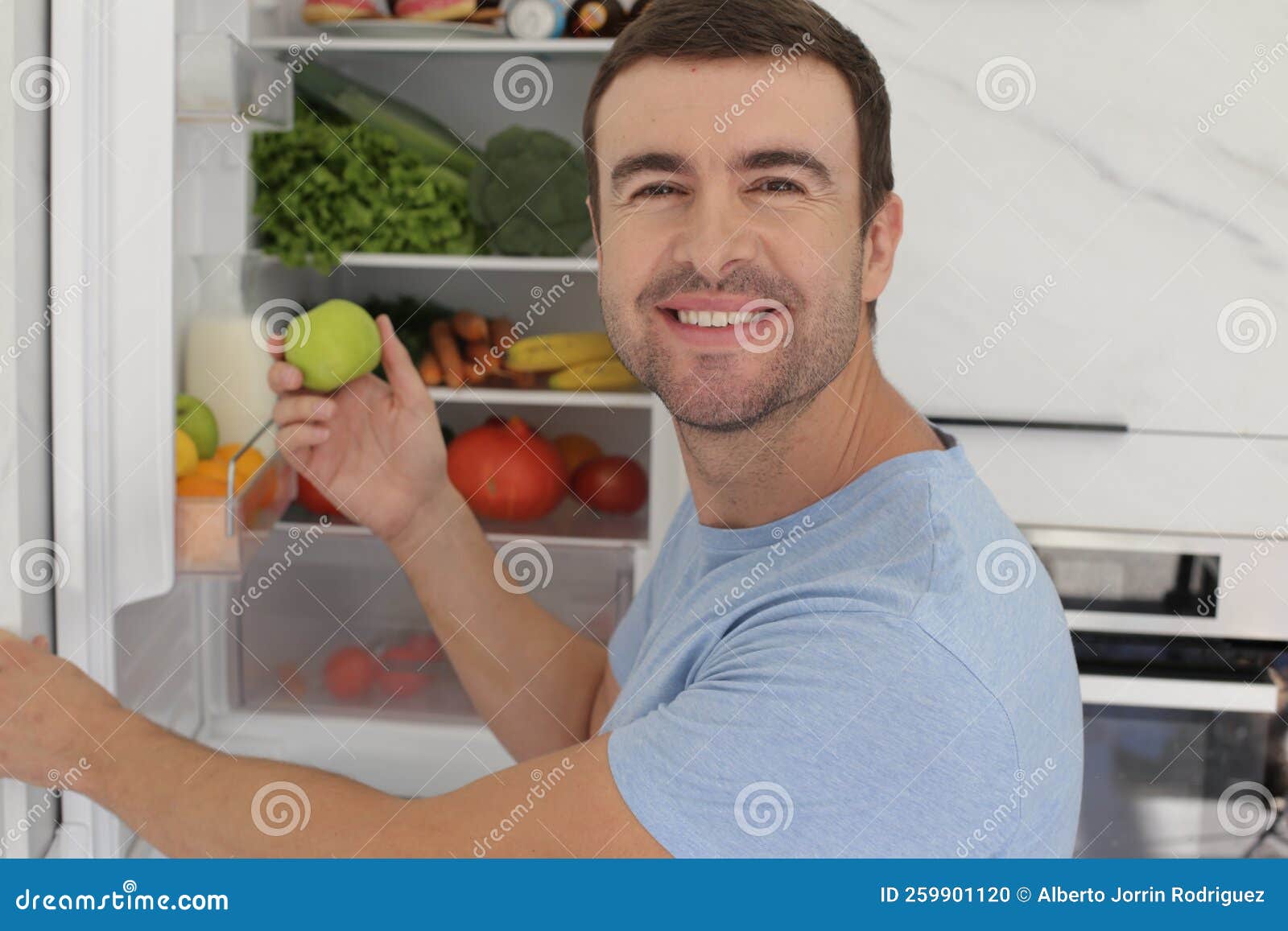 Man Taking an Apple from the Fridge Stock Photo - Image of choosing ...