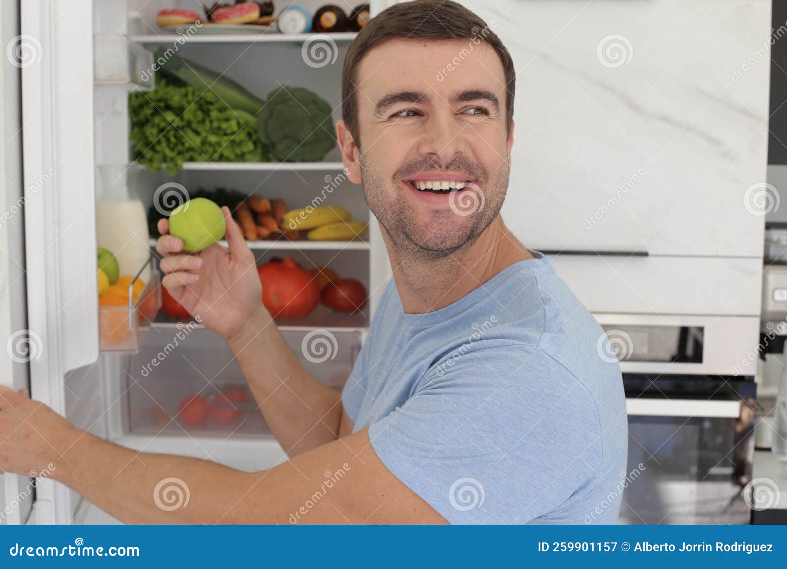 Man Taking an Apple from the Fridge Stock Image - Image of great ...