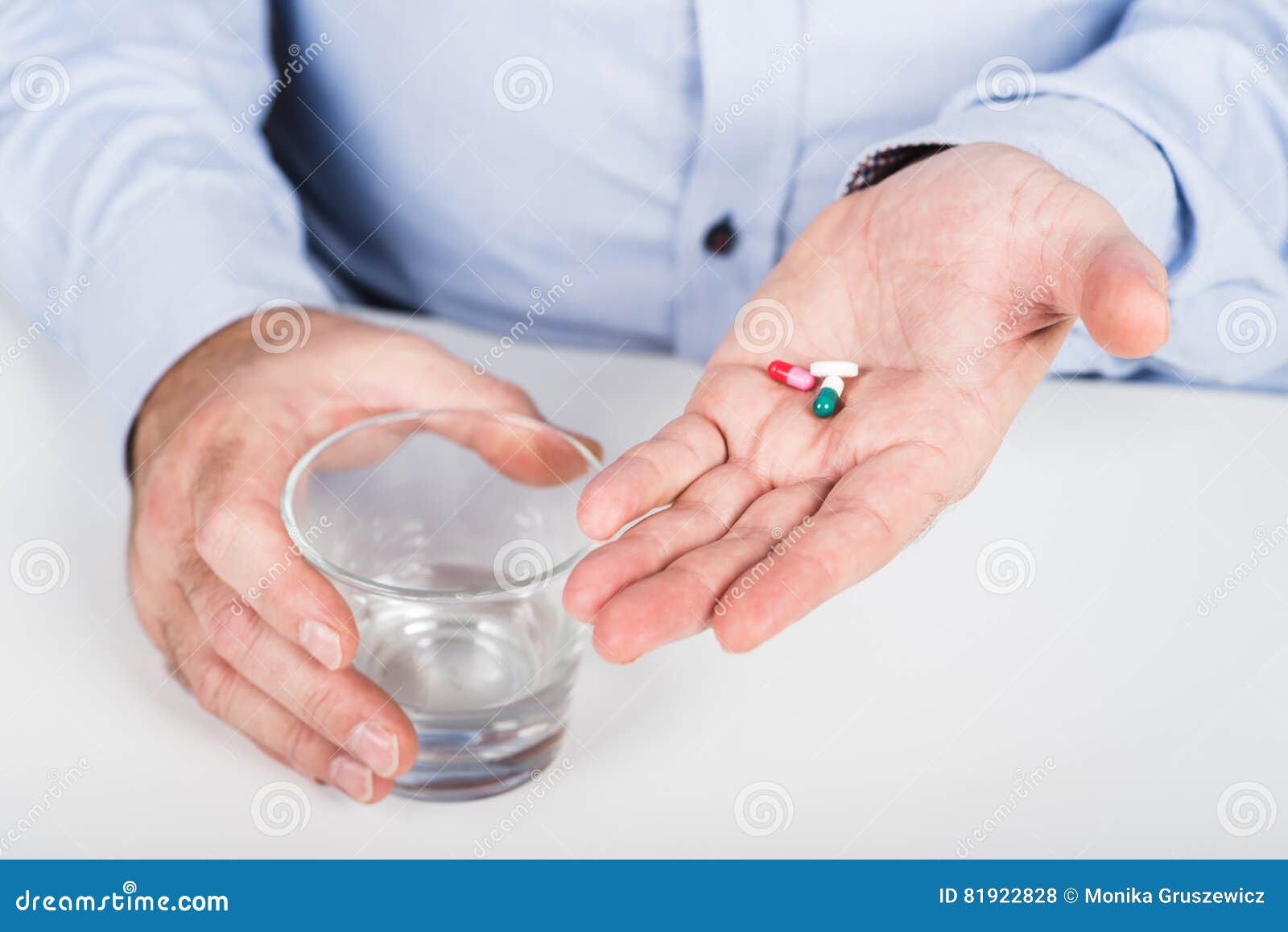 Man taking drugs stock photo. Image of medicines, bottle - 81922828