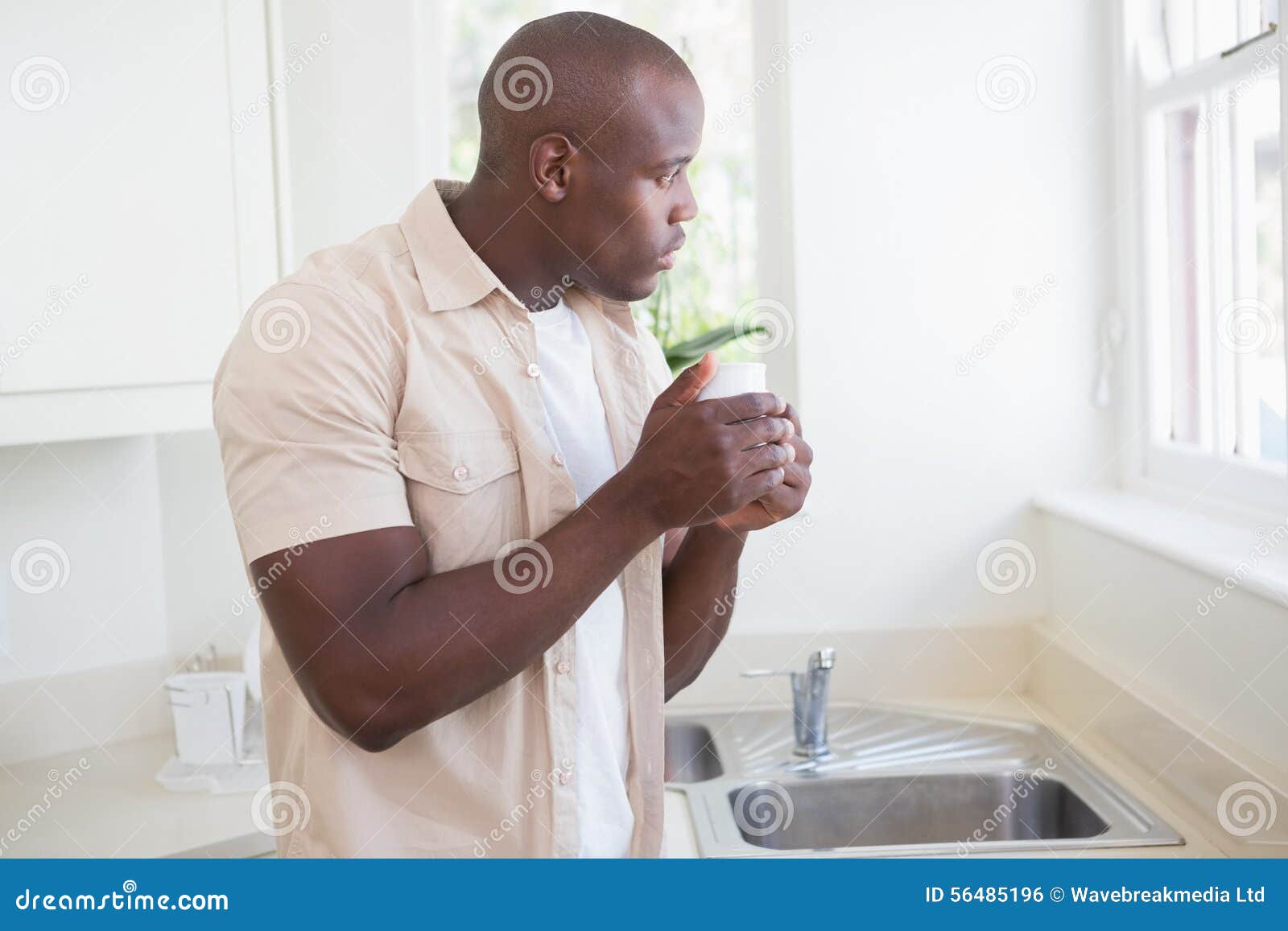 A Man Taking His Tea and Looking Outside Stock Photo - Image of ...