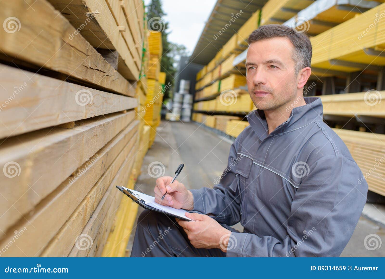 Man Taking Note in Warehouse Stock Image - Image of industry, quality ...