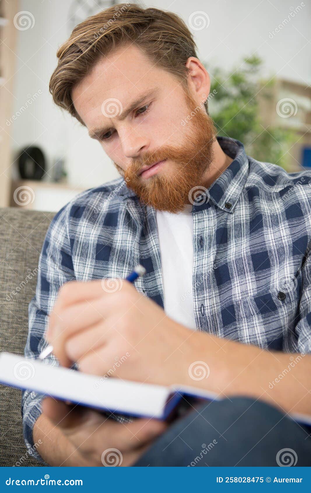 Man Taking Notes in Living Room Stock Image - Image of male, caucasian ...
