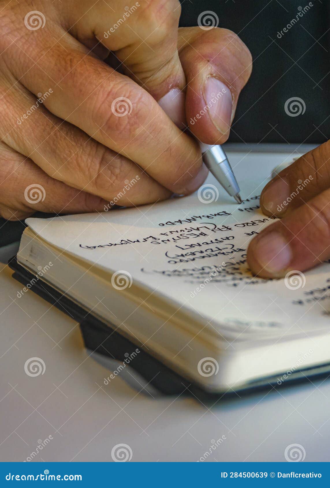Man Taking Notes at Notebook Stock Image - Image of paper, hands: 284500639