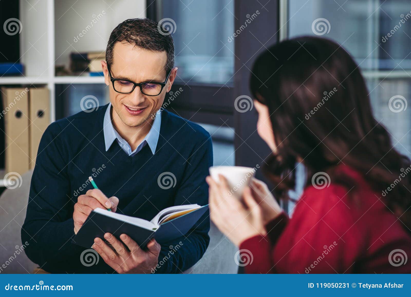 Man Taking Notes in Notebook Stock Image - Image of coffee, adult ...