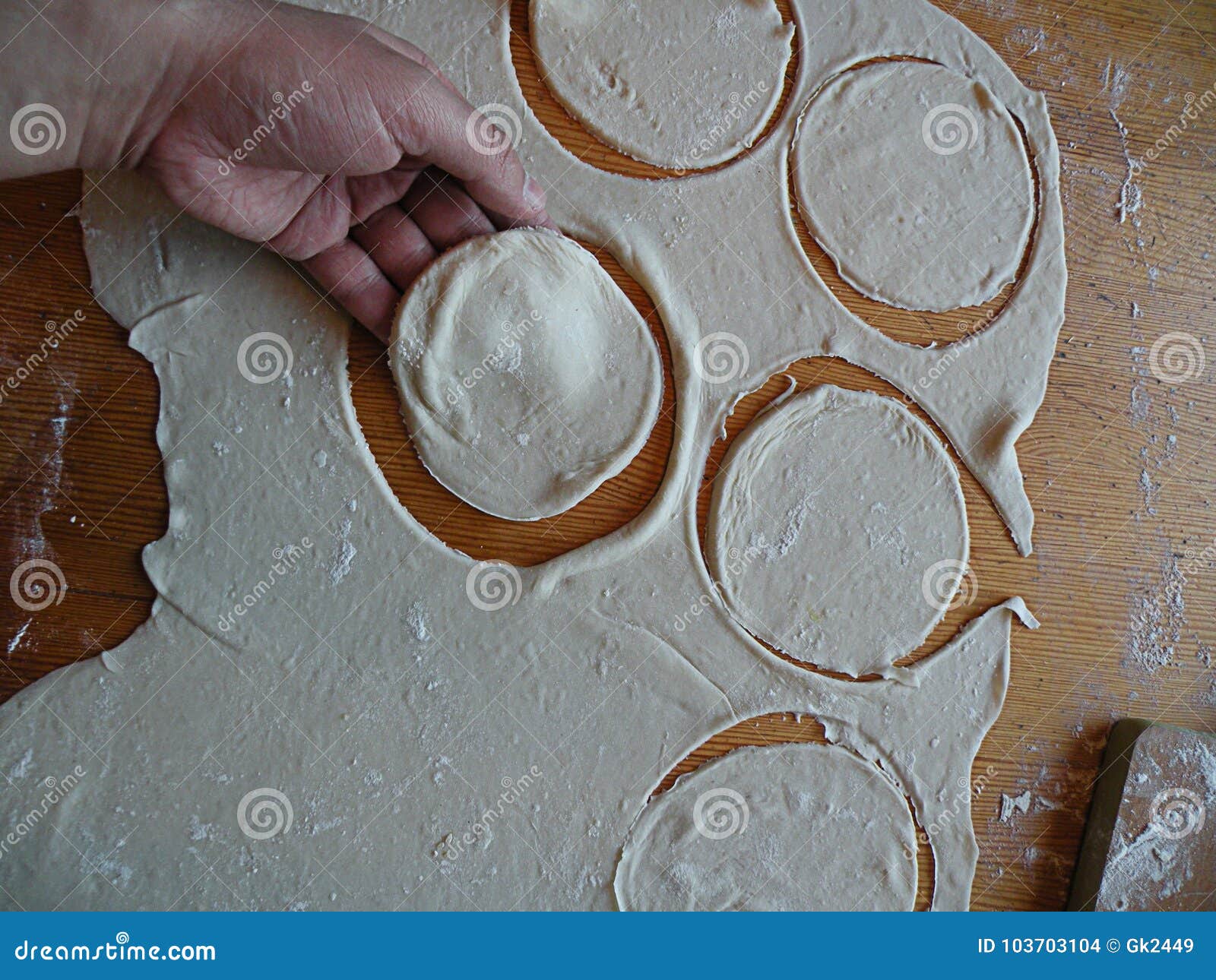 A Man Taking Off a Round Dough Stock Photo - Image of round, smeared ...